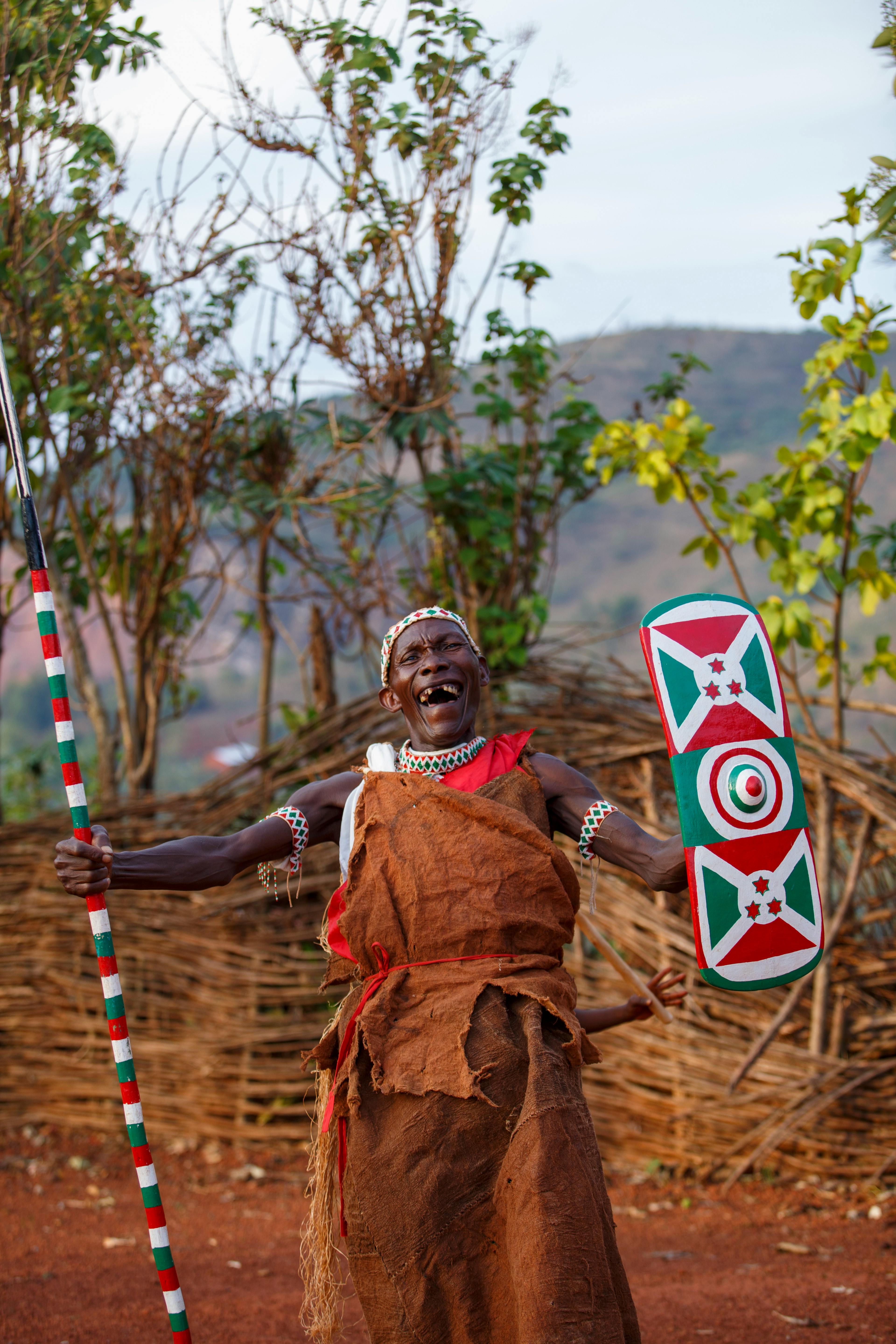 A Portrait of a Man with a Painted Body and Face Wearing Tribal ...