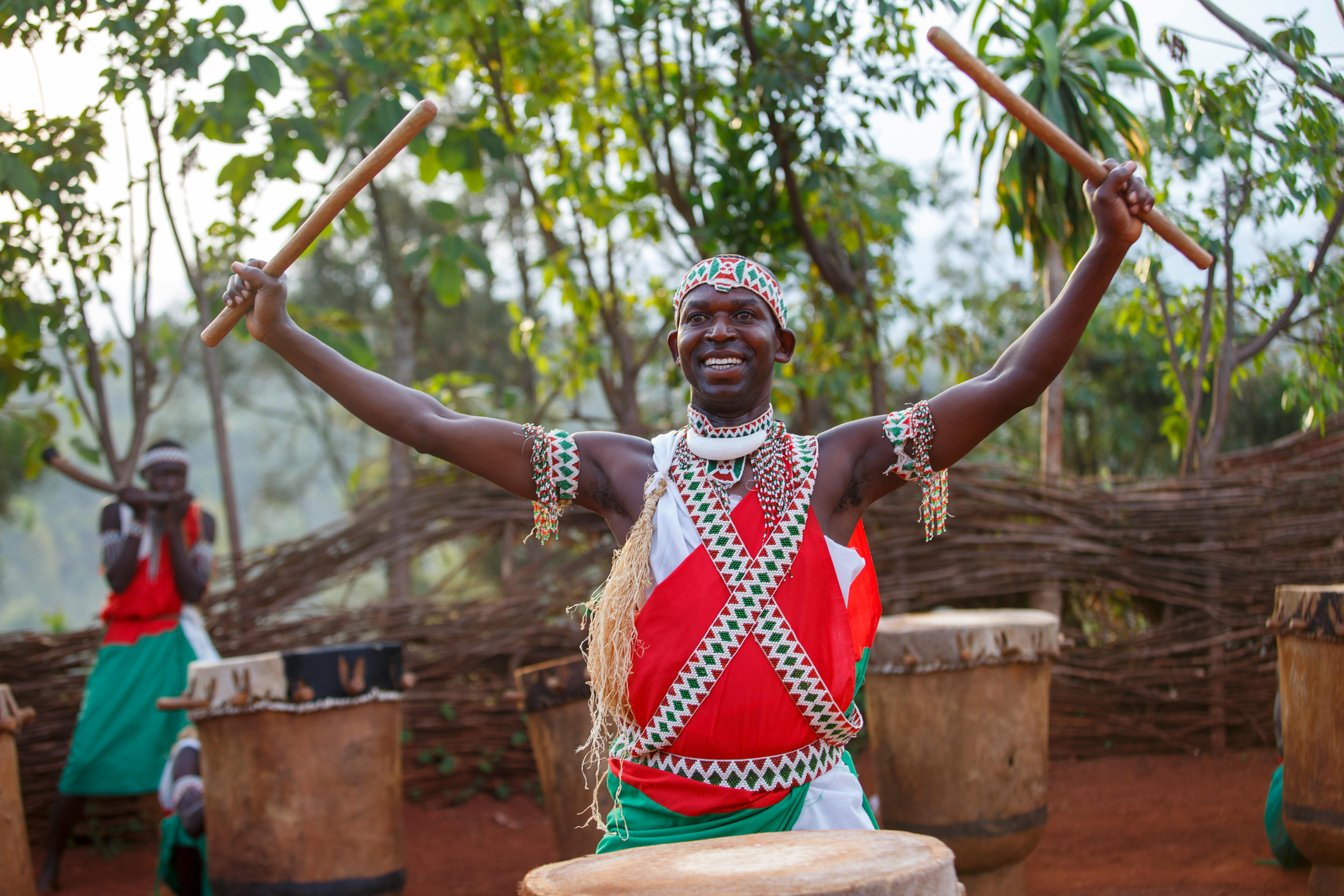Happy People Playing Drums in Traditional Tribal Clothing · Free Stock ...