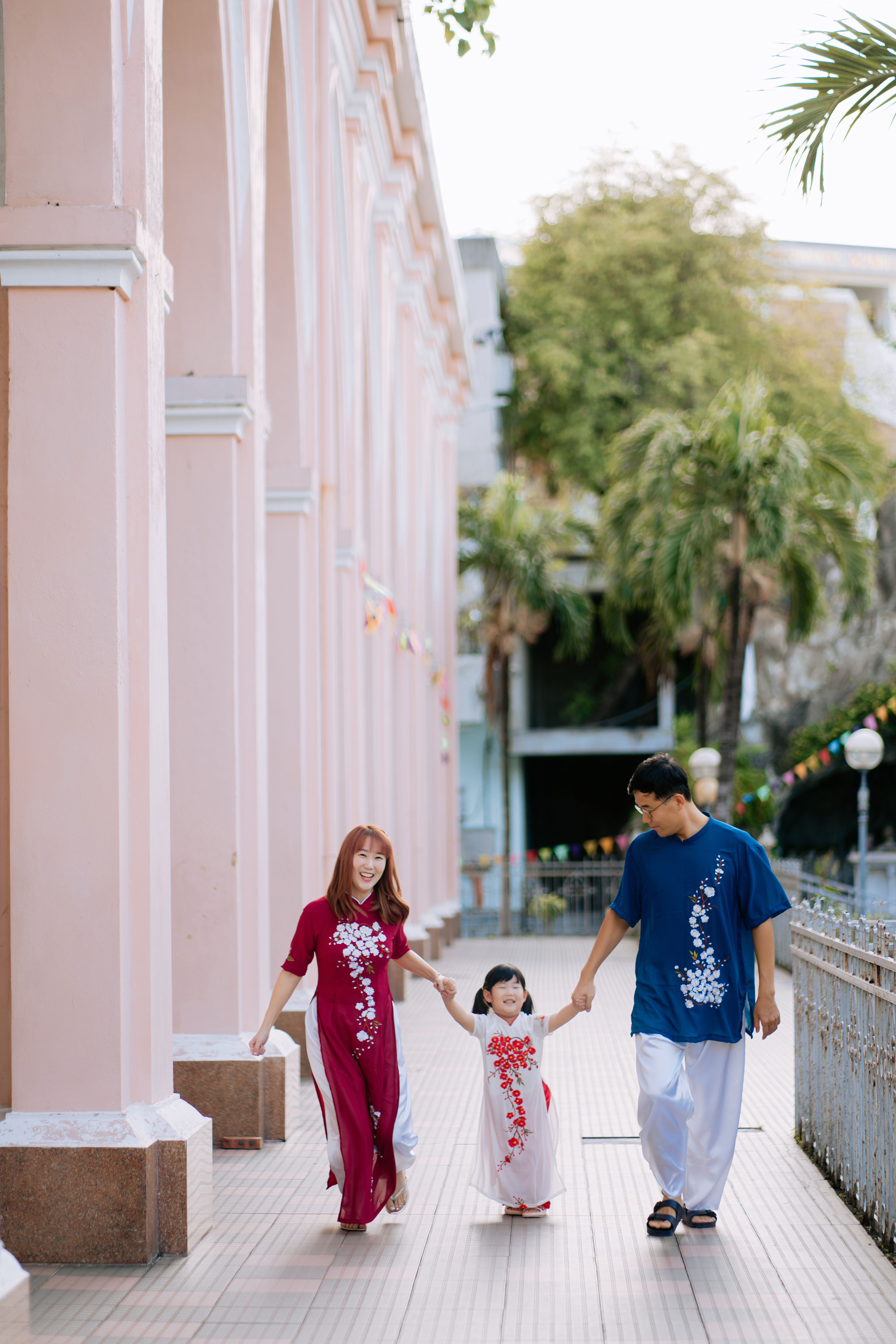 Photo of a Family Walking Down the Street and Holding Hands · Free ...