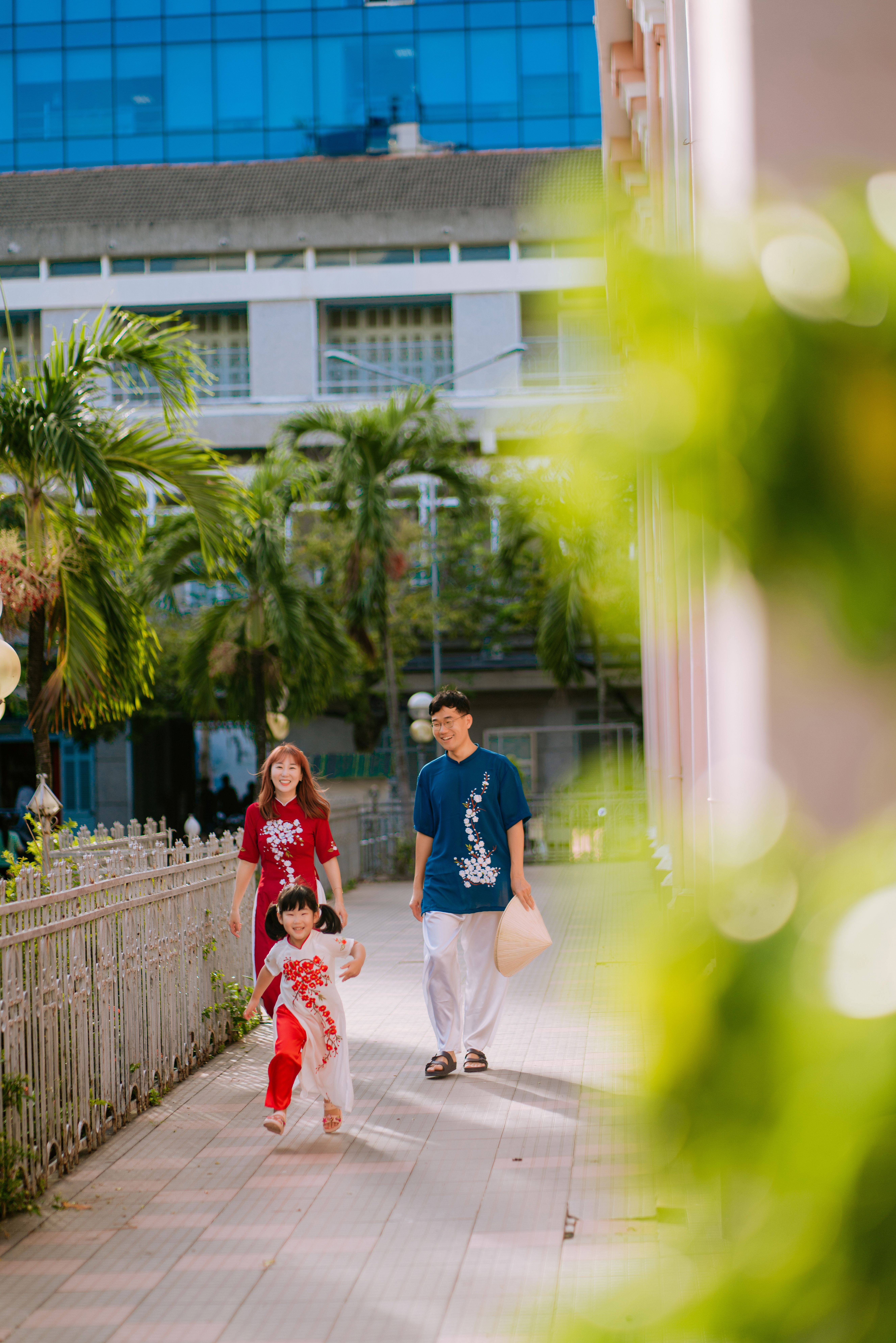 A Kid Running Ahead of Her Parents · Free Stock Photo
