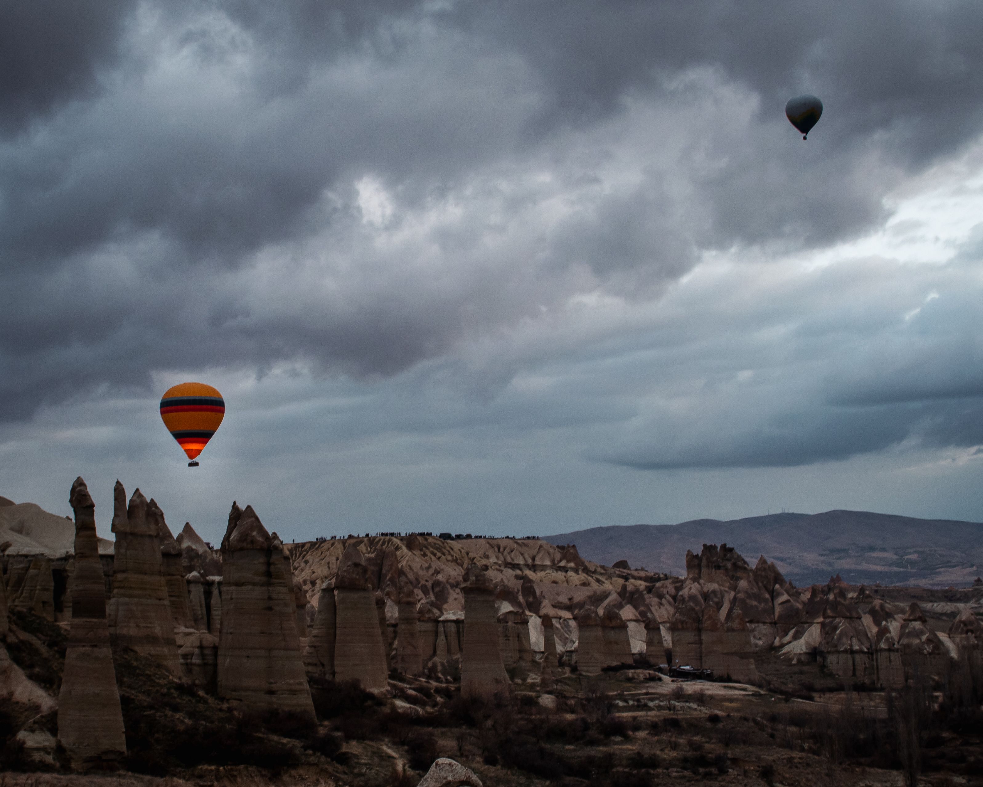 Hot Air Balloons Flying over the Rock Formation · Free Stock Photo