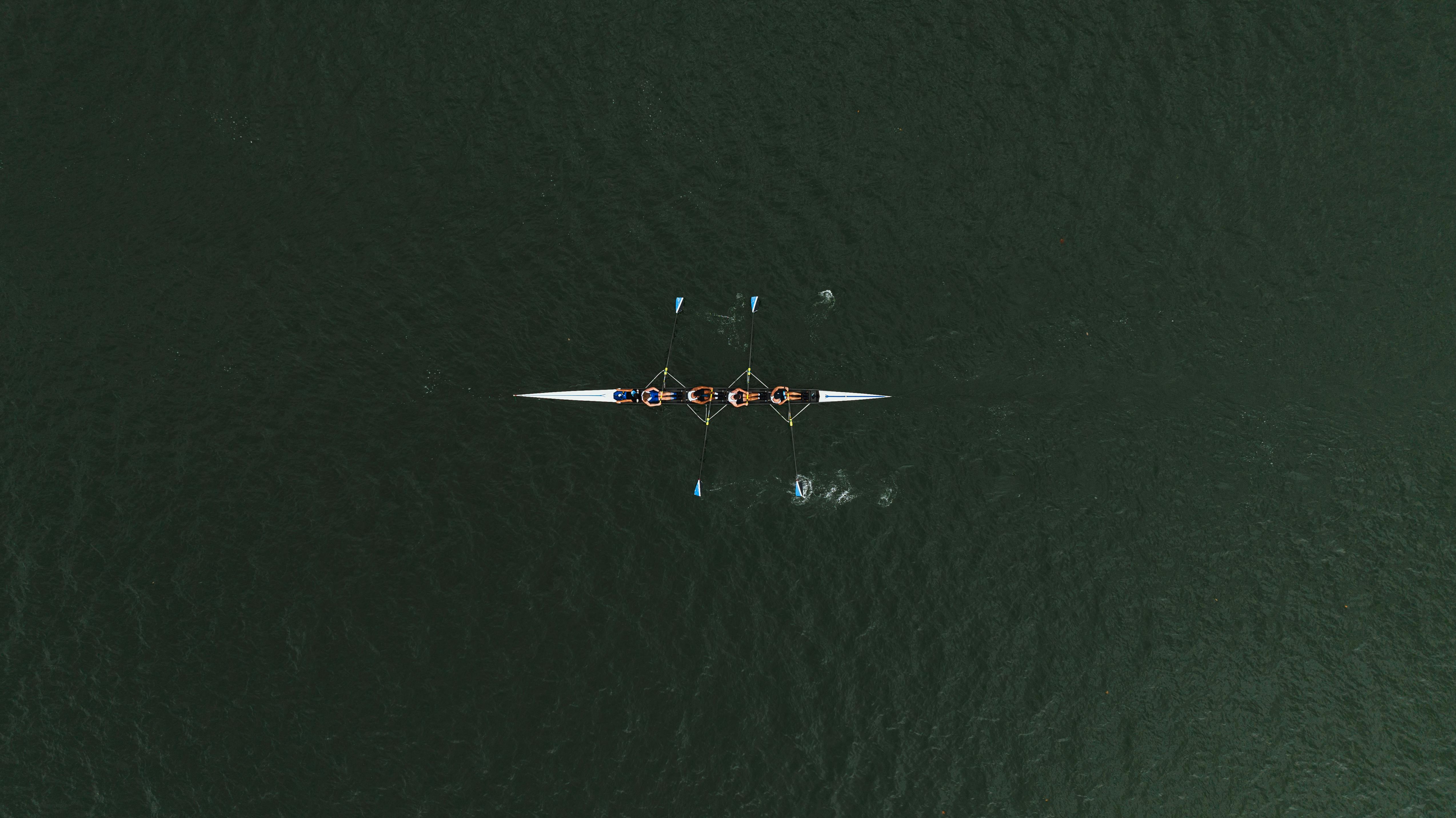 Top View Photo of People on a Rowing Boat · Free Stock Photo
