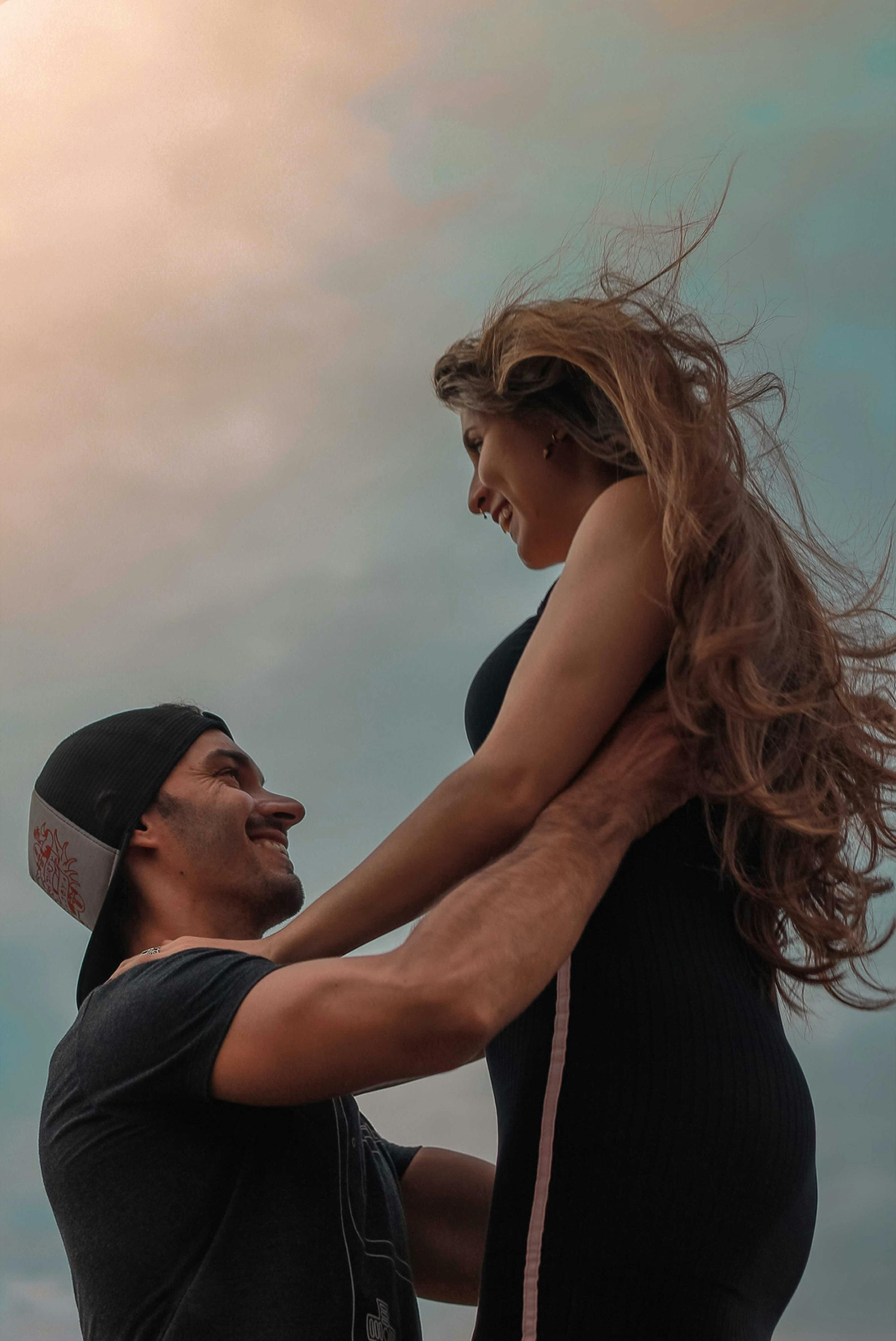 Man Carrying Woman on Back · Free Stock Photo