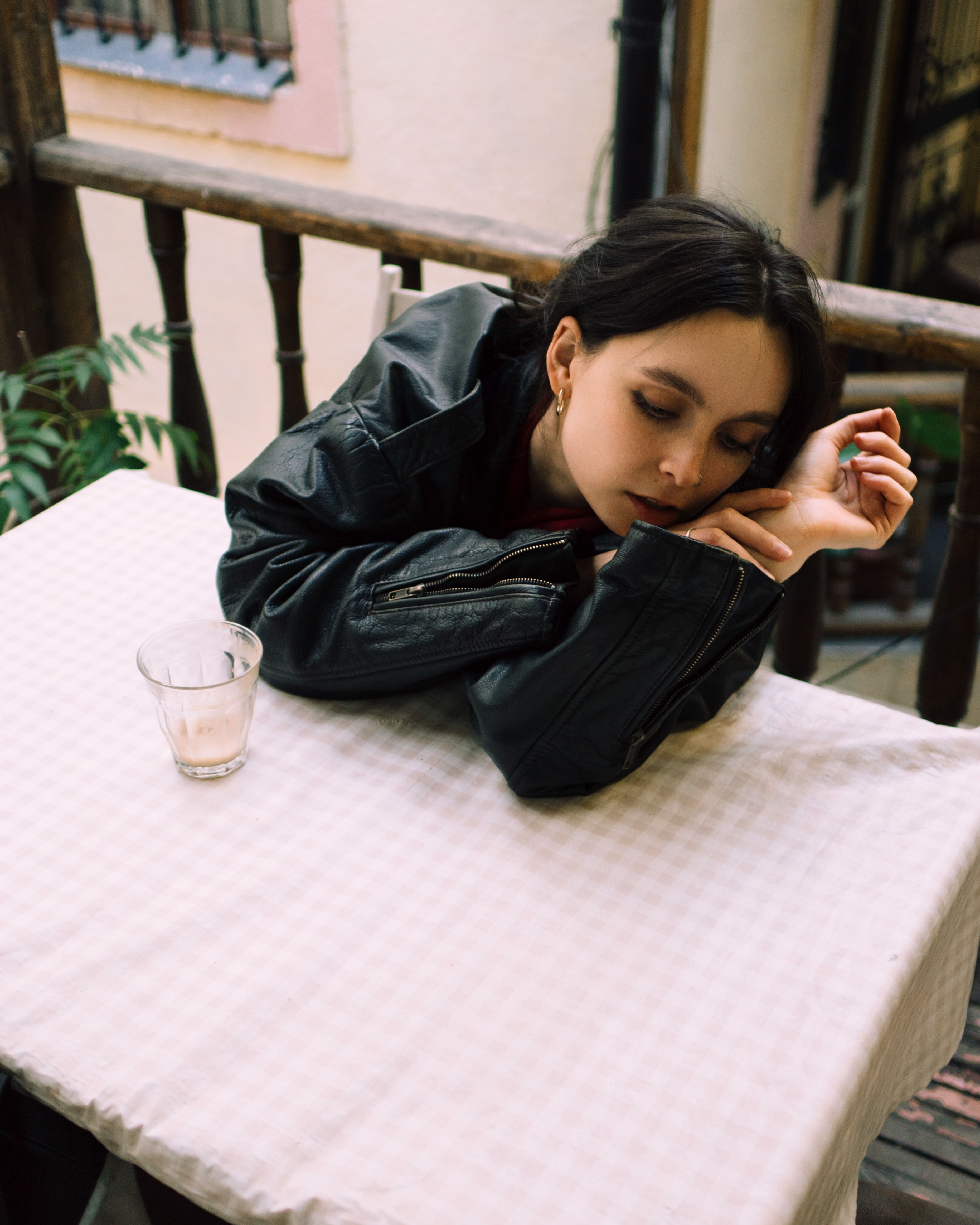 A Woman Leaning on Table · Free Stock Photo