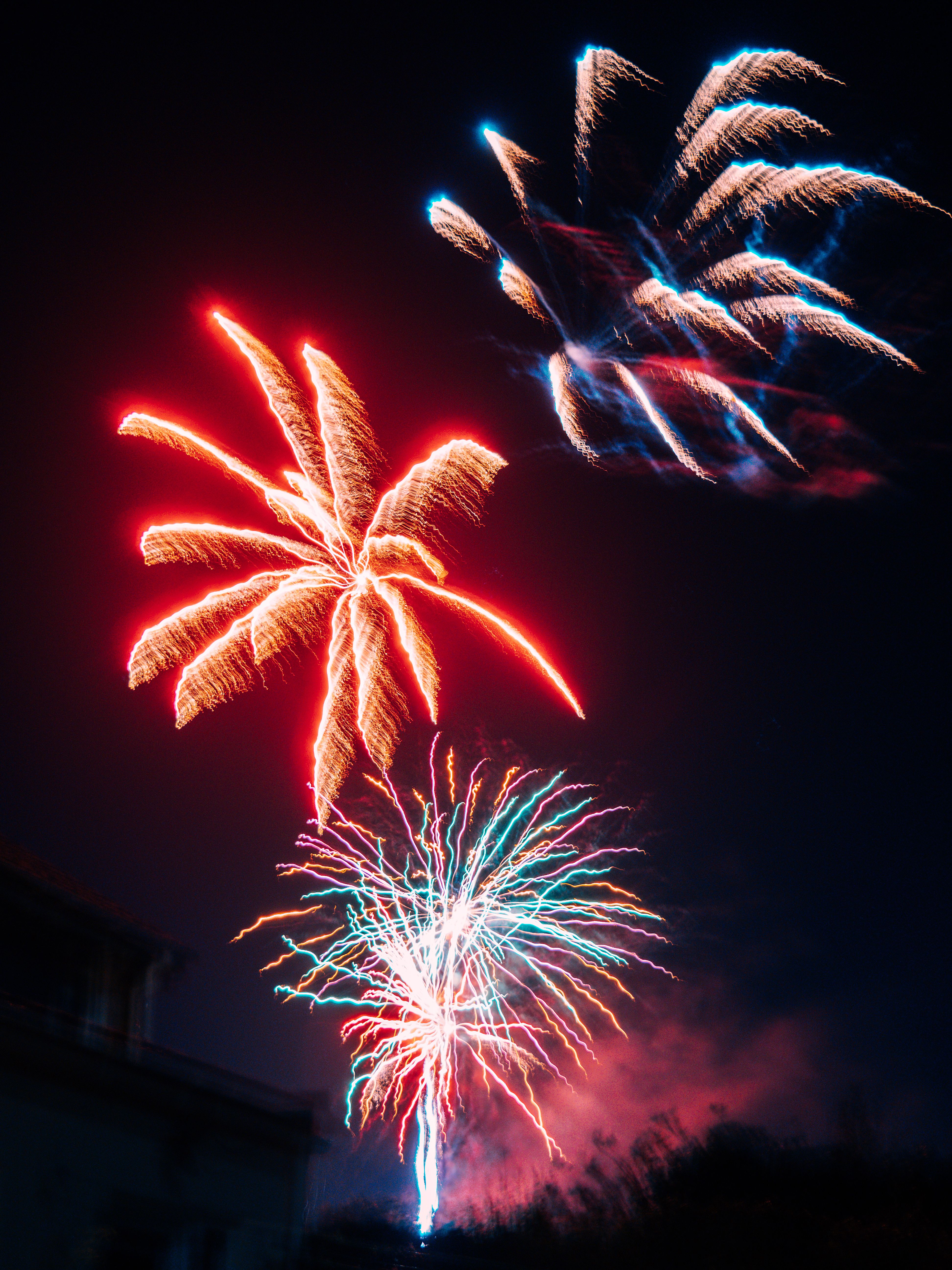 A Batch of Fireworks Display Illuminating the Dark Sky · Free Stock Photo