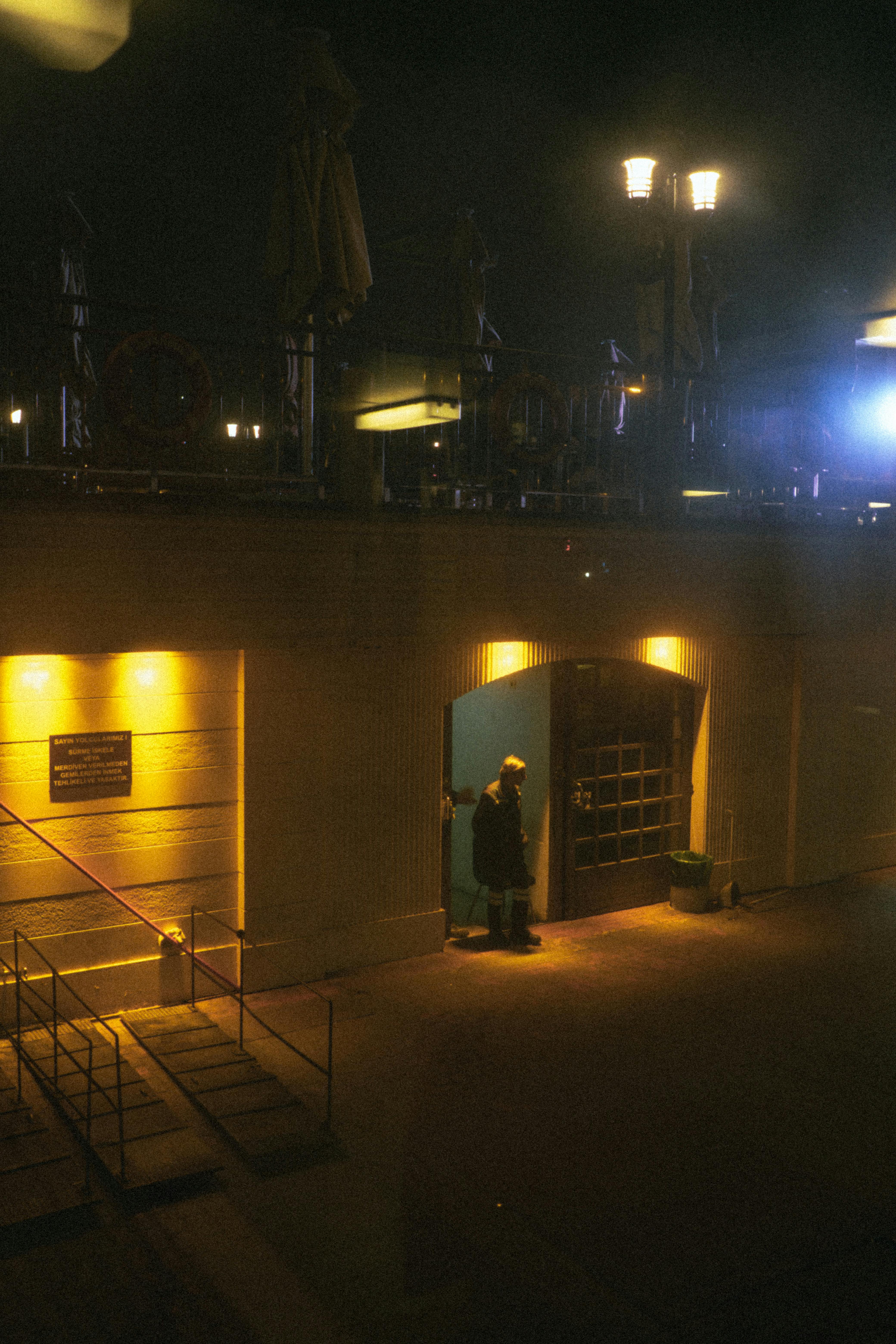 A Person Standing at the Doorway · Free Stock Photo