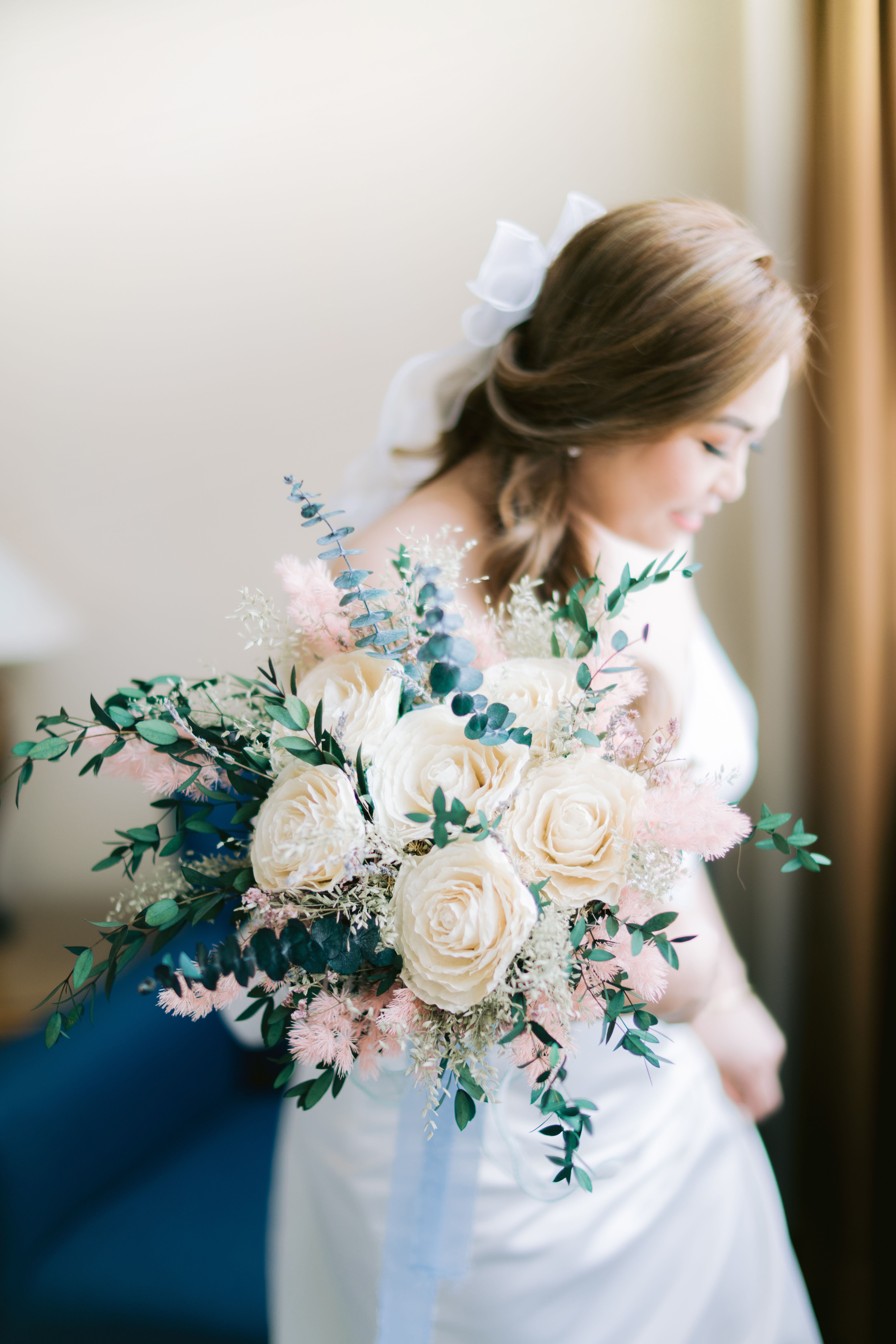 A Bride Holding Her Bridal Bouquet · Free Stock Photo