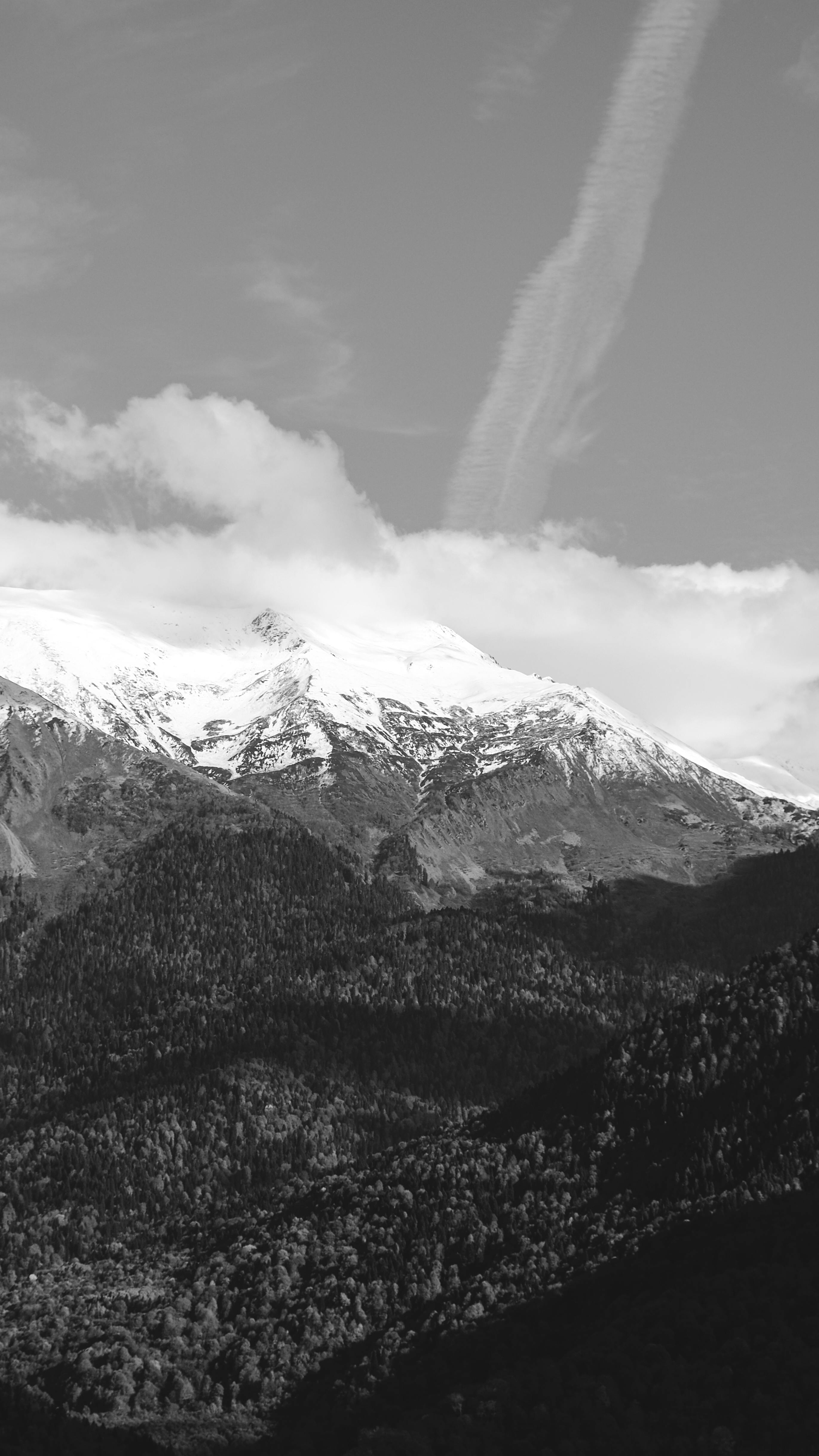 Grayscale Photo of Snow Capped Mountains · Free Stock Photo
