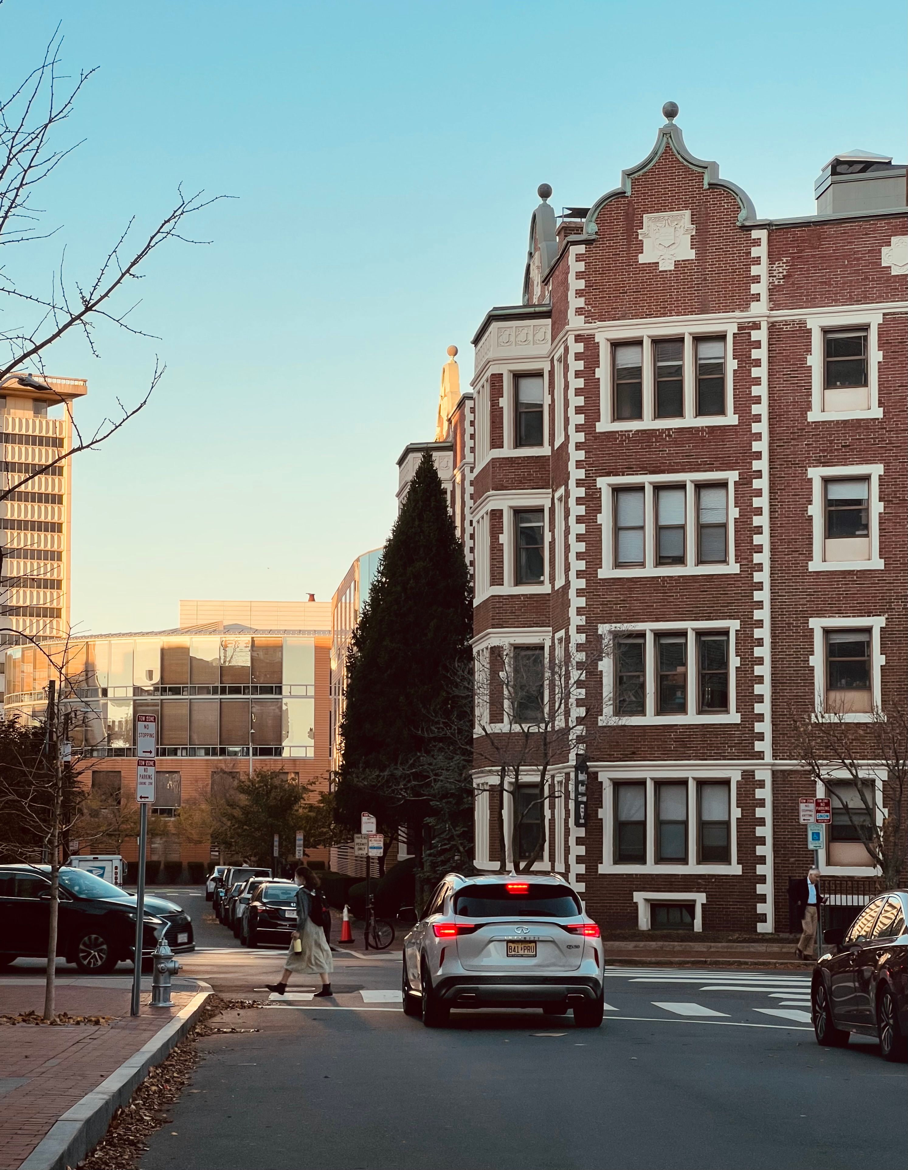 Cars Parked in Front of Brown Concrete Building · Free Stock Photo