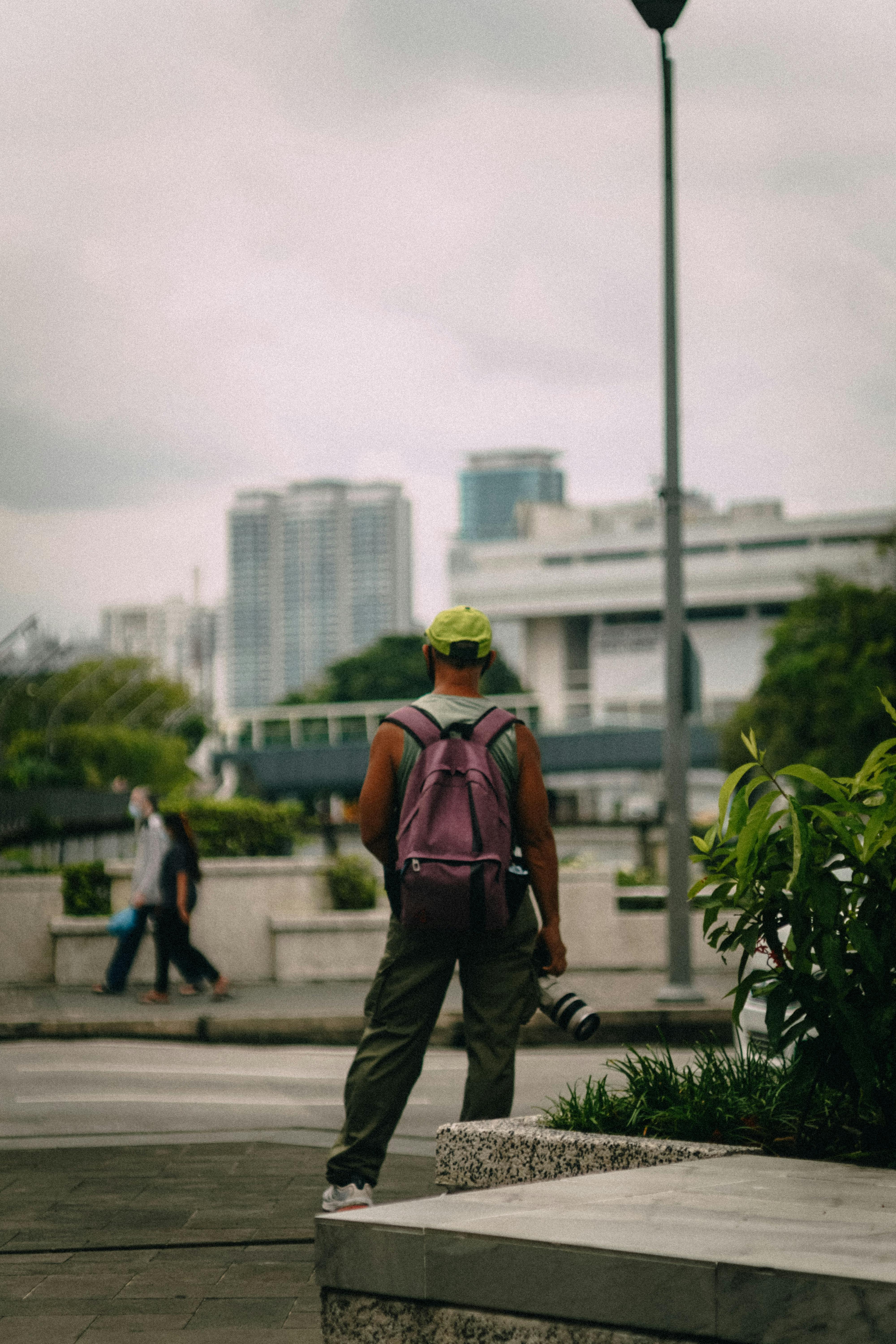 A Man Standing with Backpack · Free Stock Photo