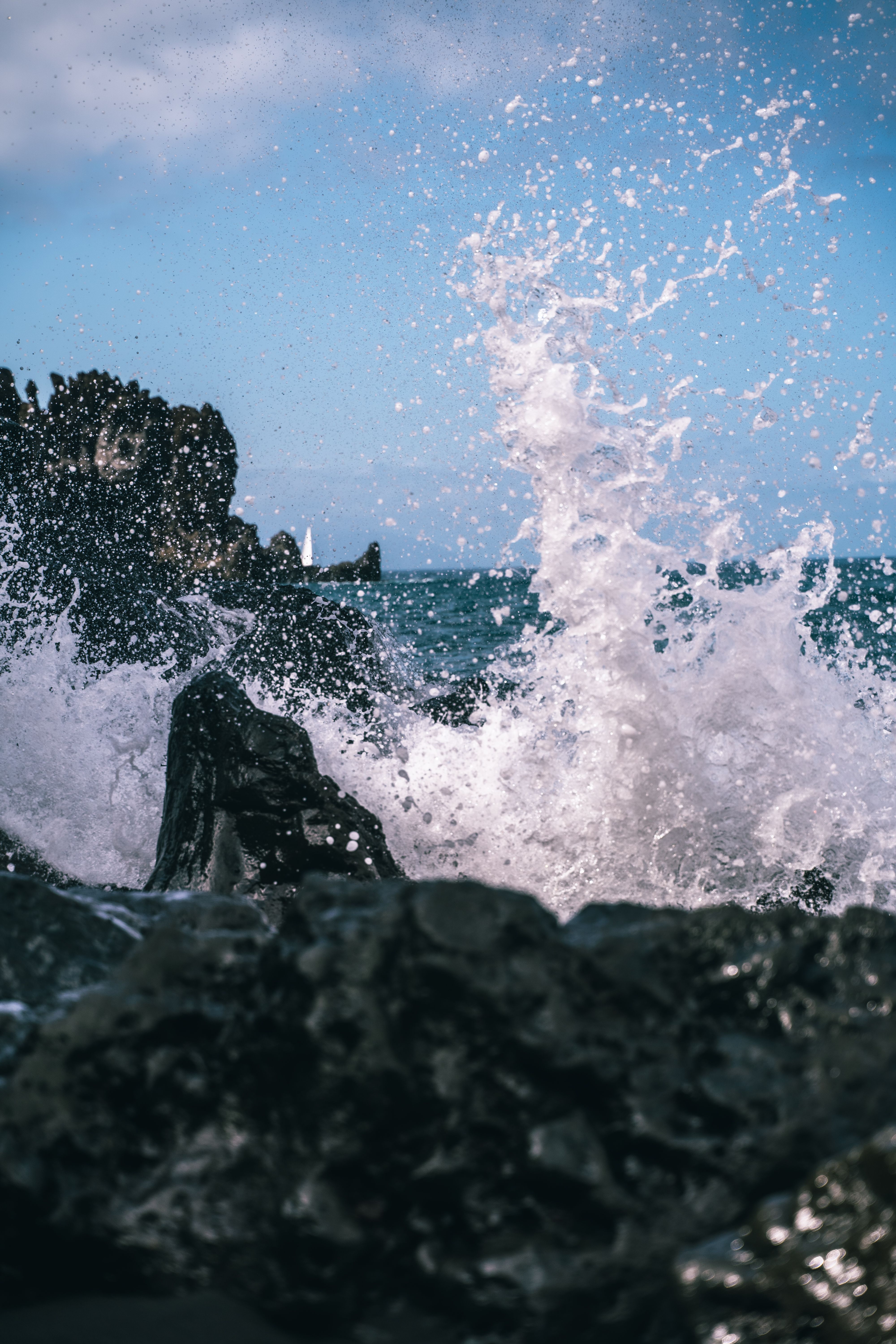 Close-Up Photo of Water Splash Near a Rock · Free Stock Photo