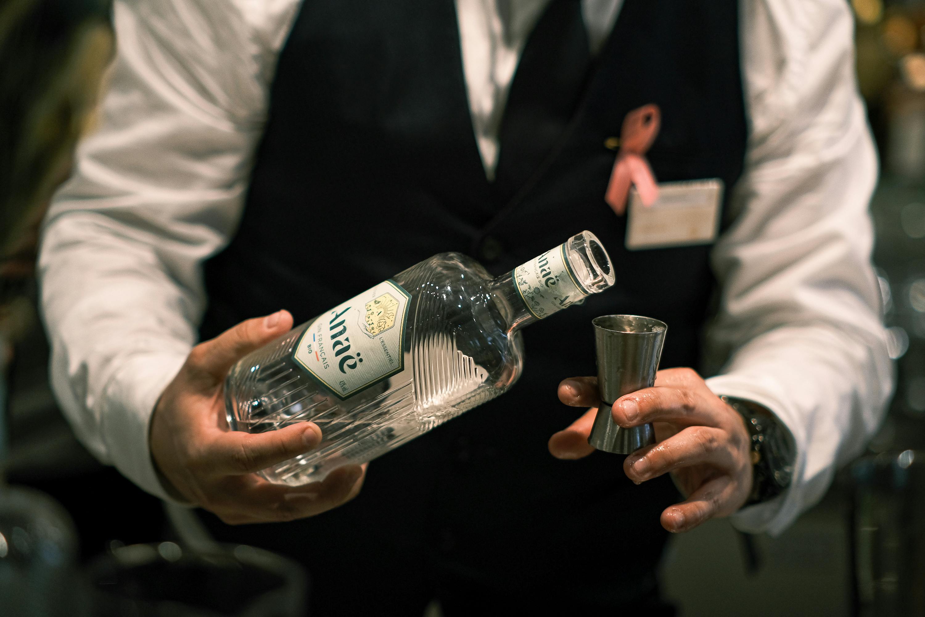 Close-up of a Bartender Pouring a Shot of Gin · Free Stock Photo