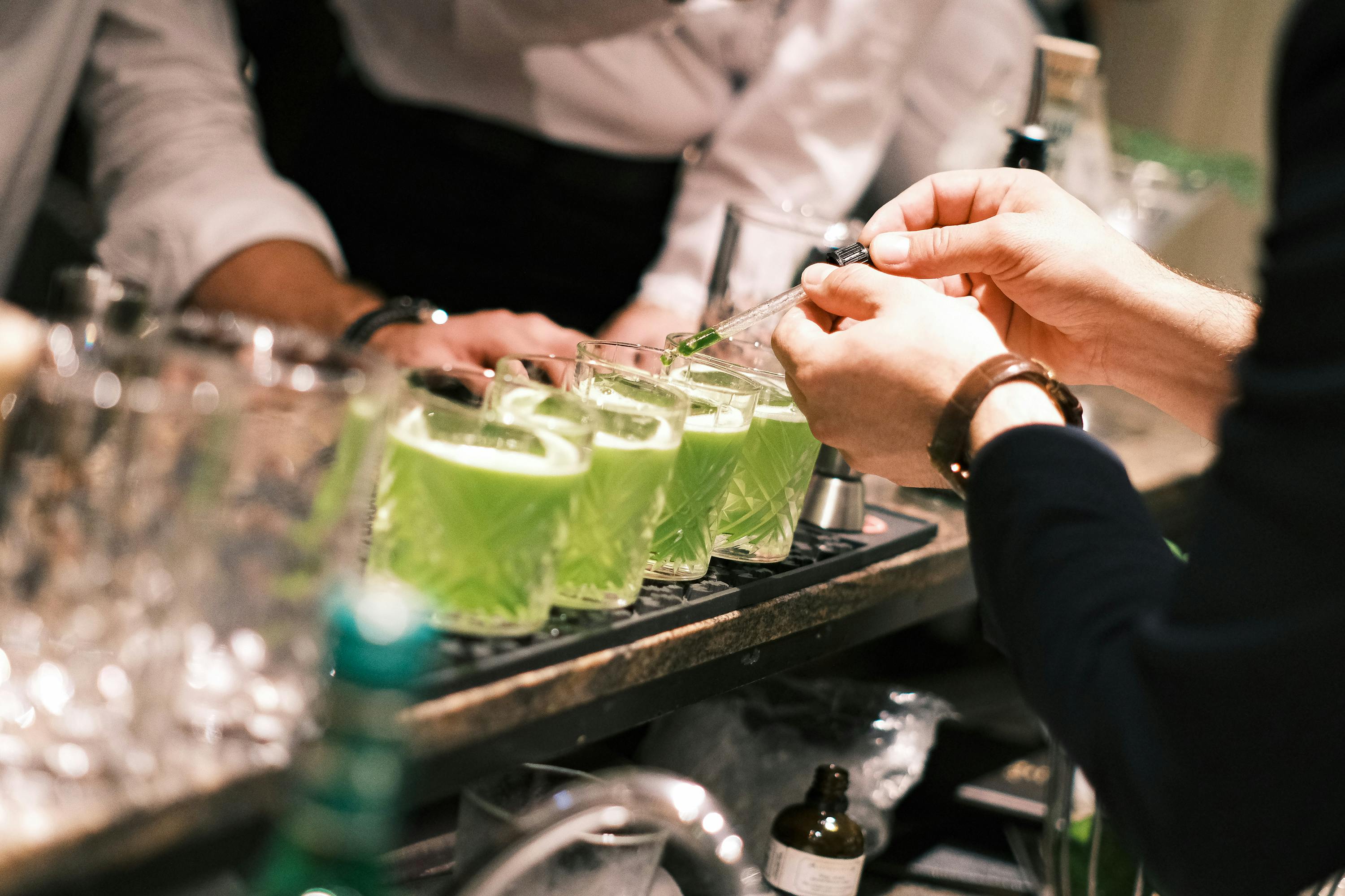 Close-up of Bartender Making Green Cocktails · Free Stock Photo