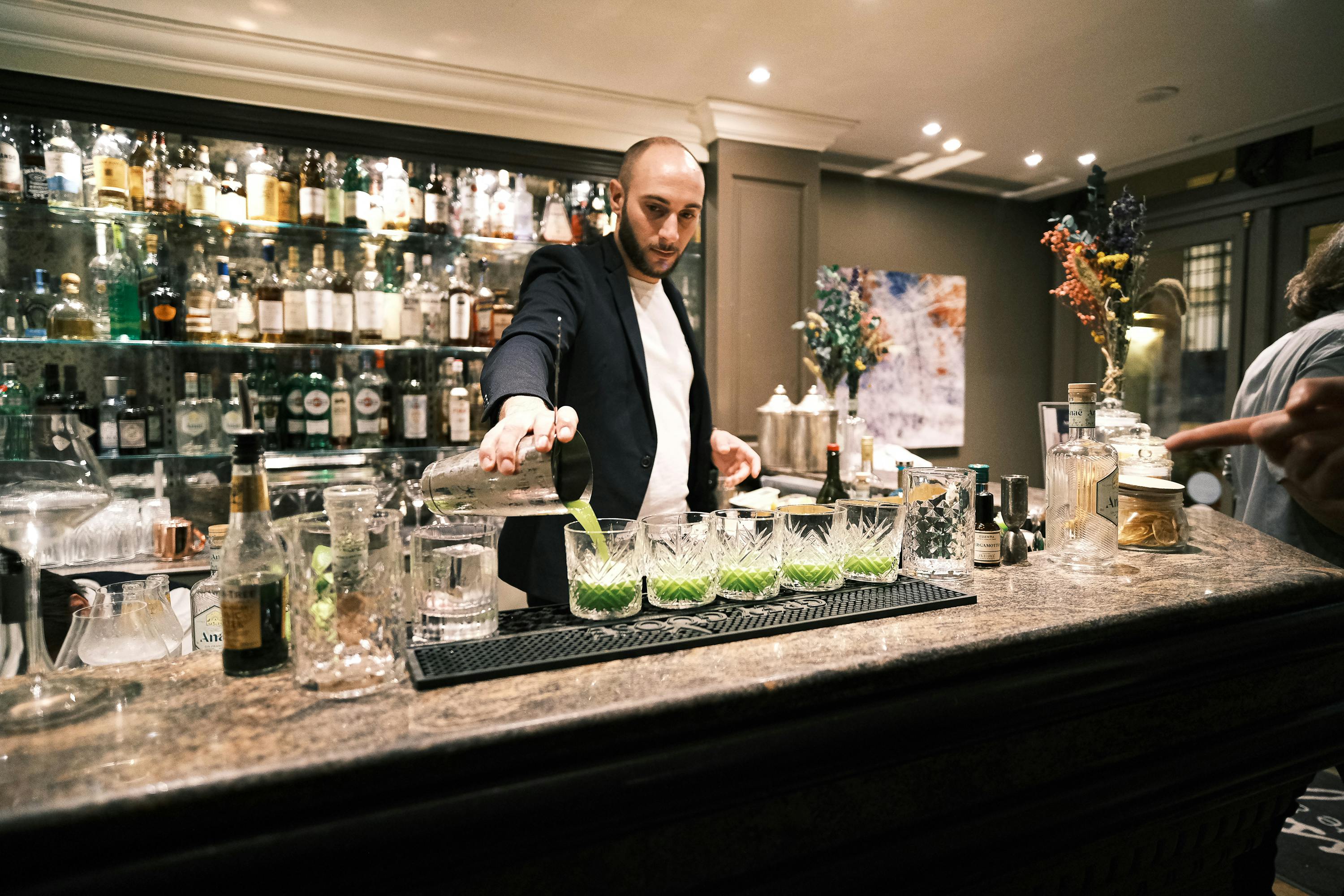 Barmen Making Drink at Counter · Free Stock Photo