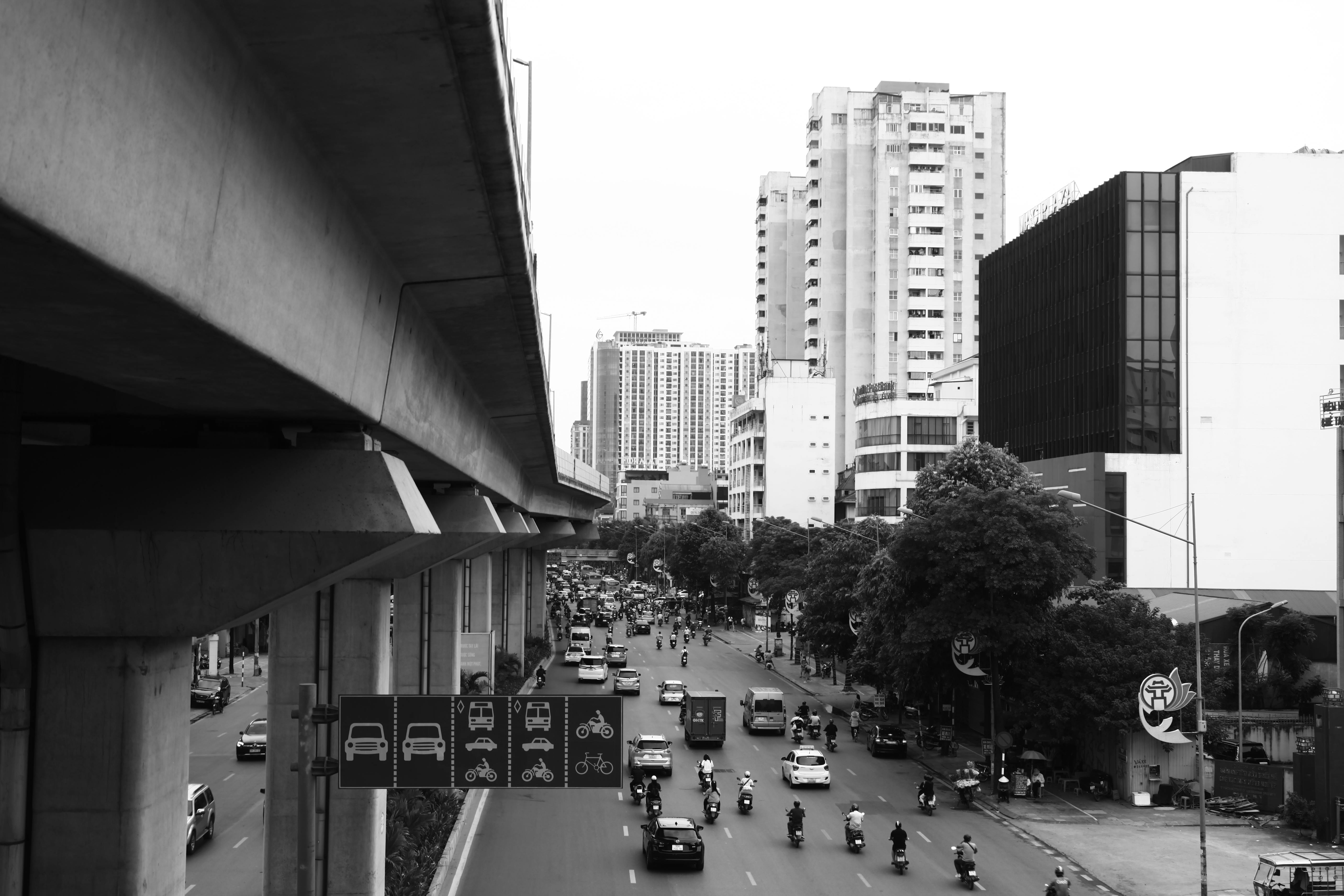 A Moving Cars and Motorcycles Passing on an Under Construction Building ...