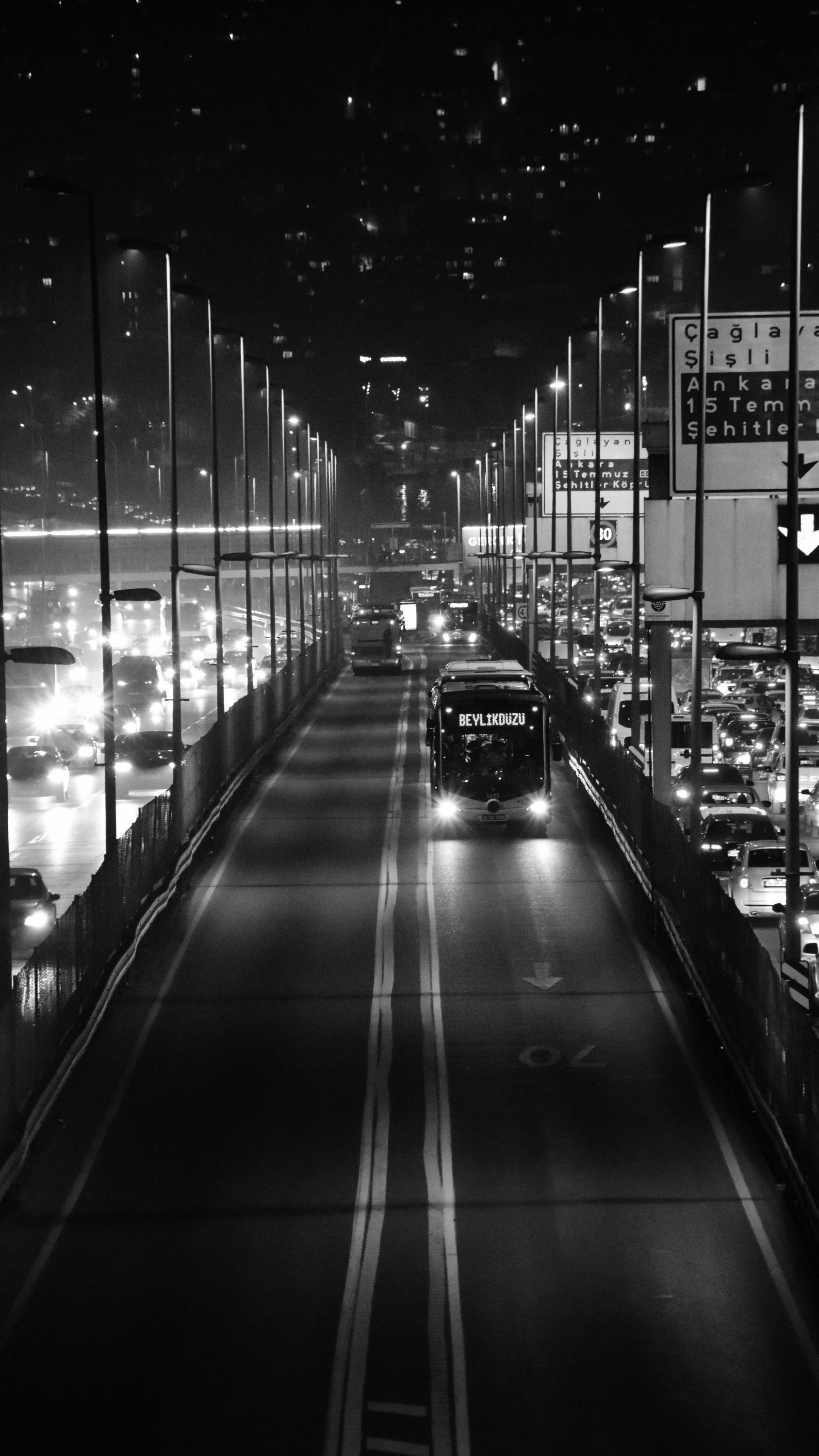 Black and White Photo of Buses Riding on a Night Road · Free Stock Photo