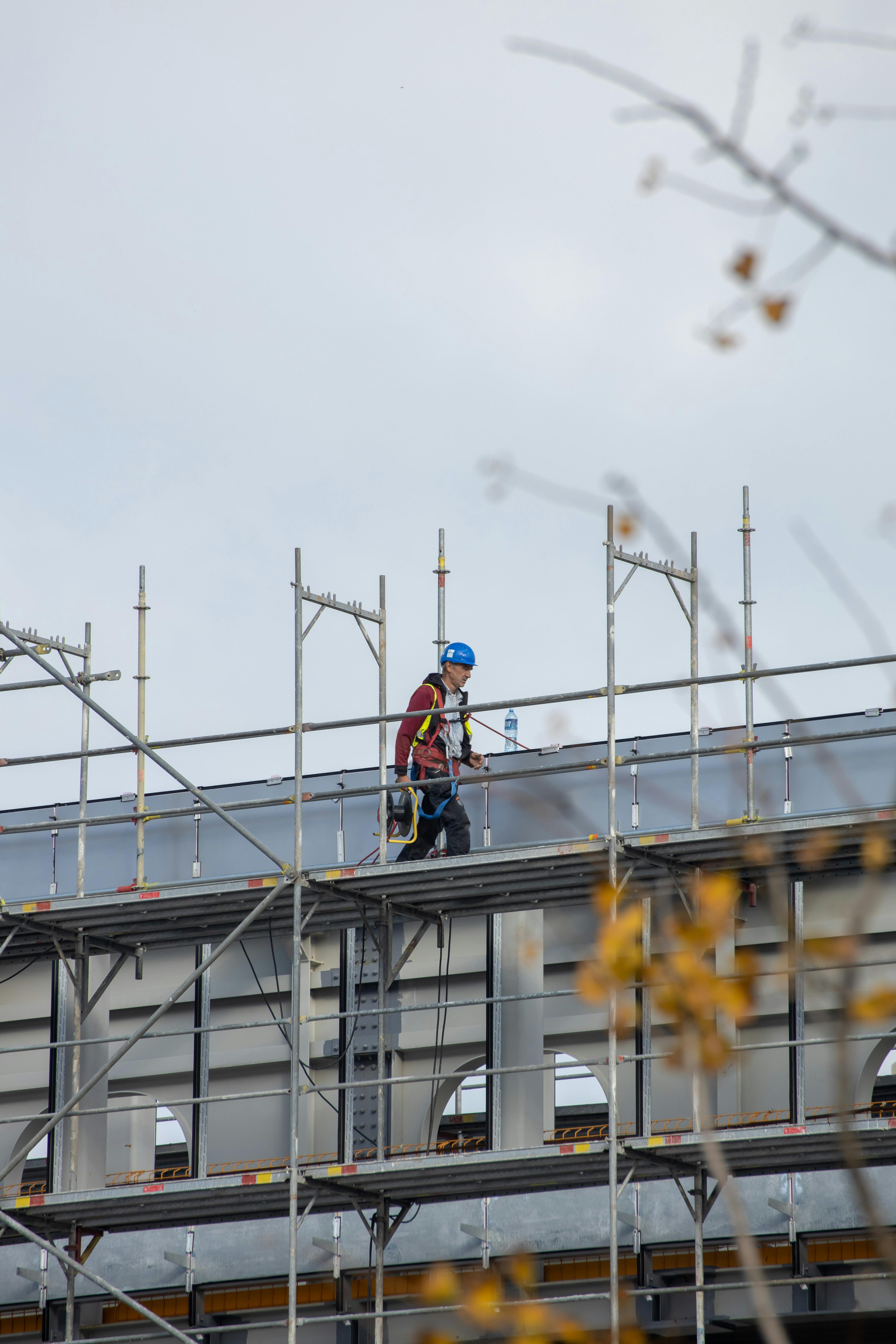 Man Walking on the Scaffolding · Free Stock Photo