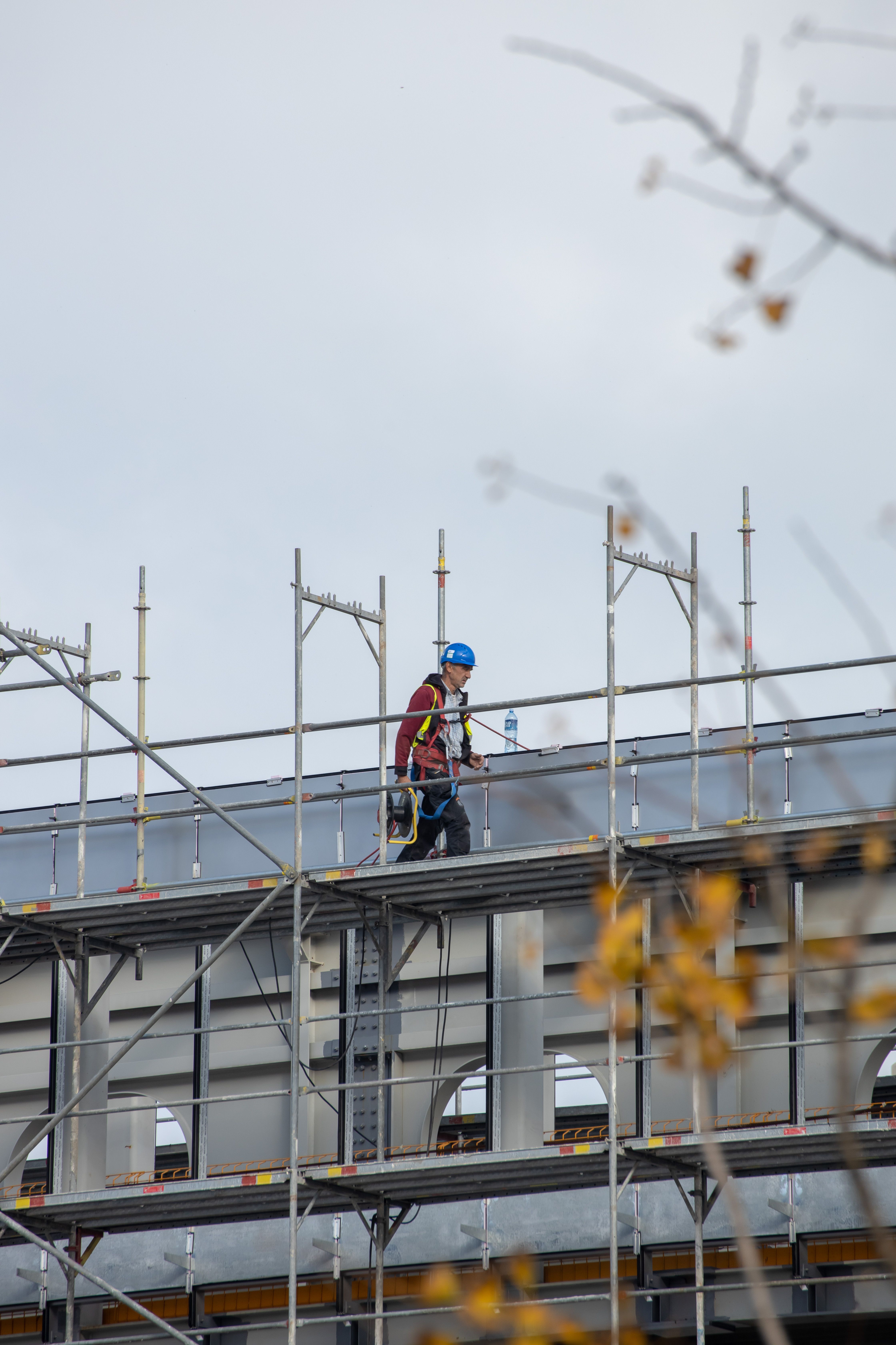 Men on Brown Scaffolding · Free Stock Photo