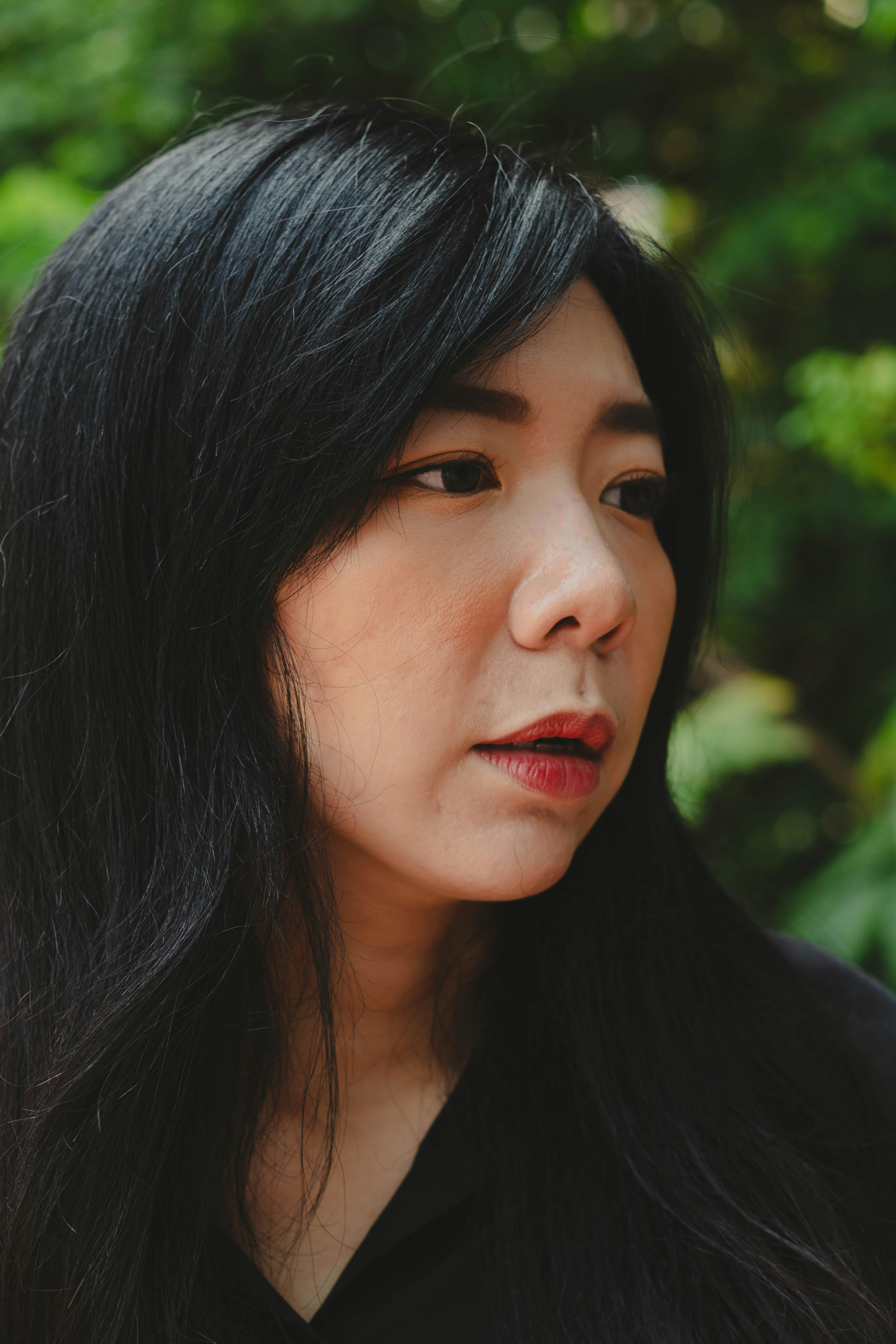 A Woman Putting Cold Compress on Her Face · Free Stock Photo