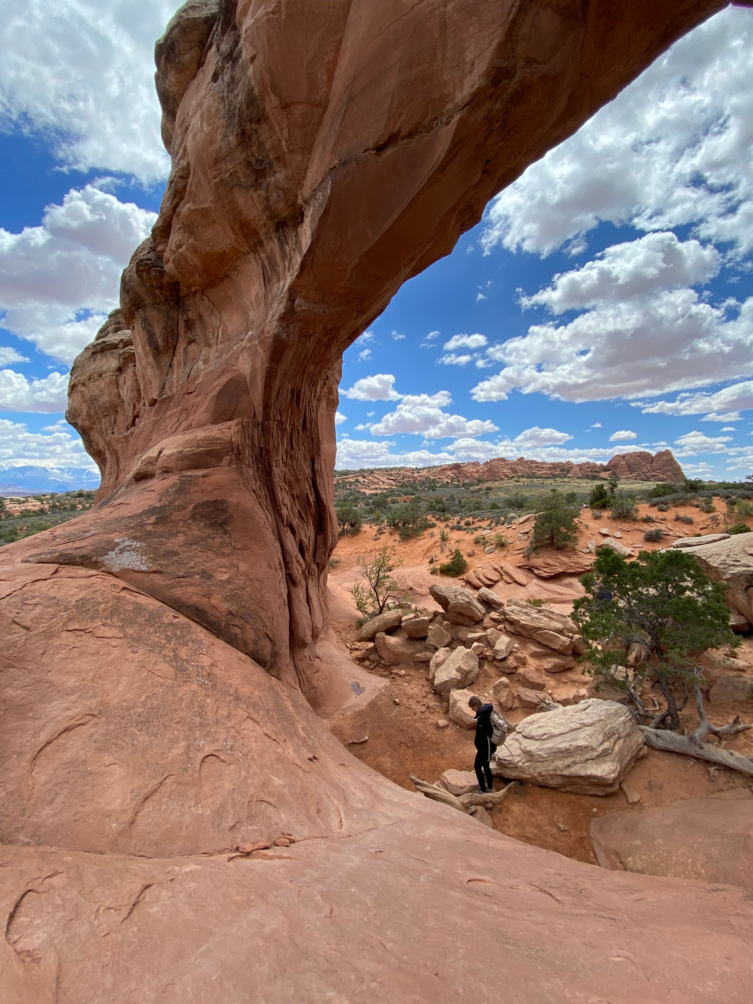 Man Standing under Natural Arch · Free Stock Photo