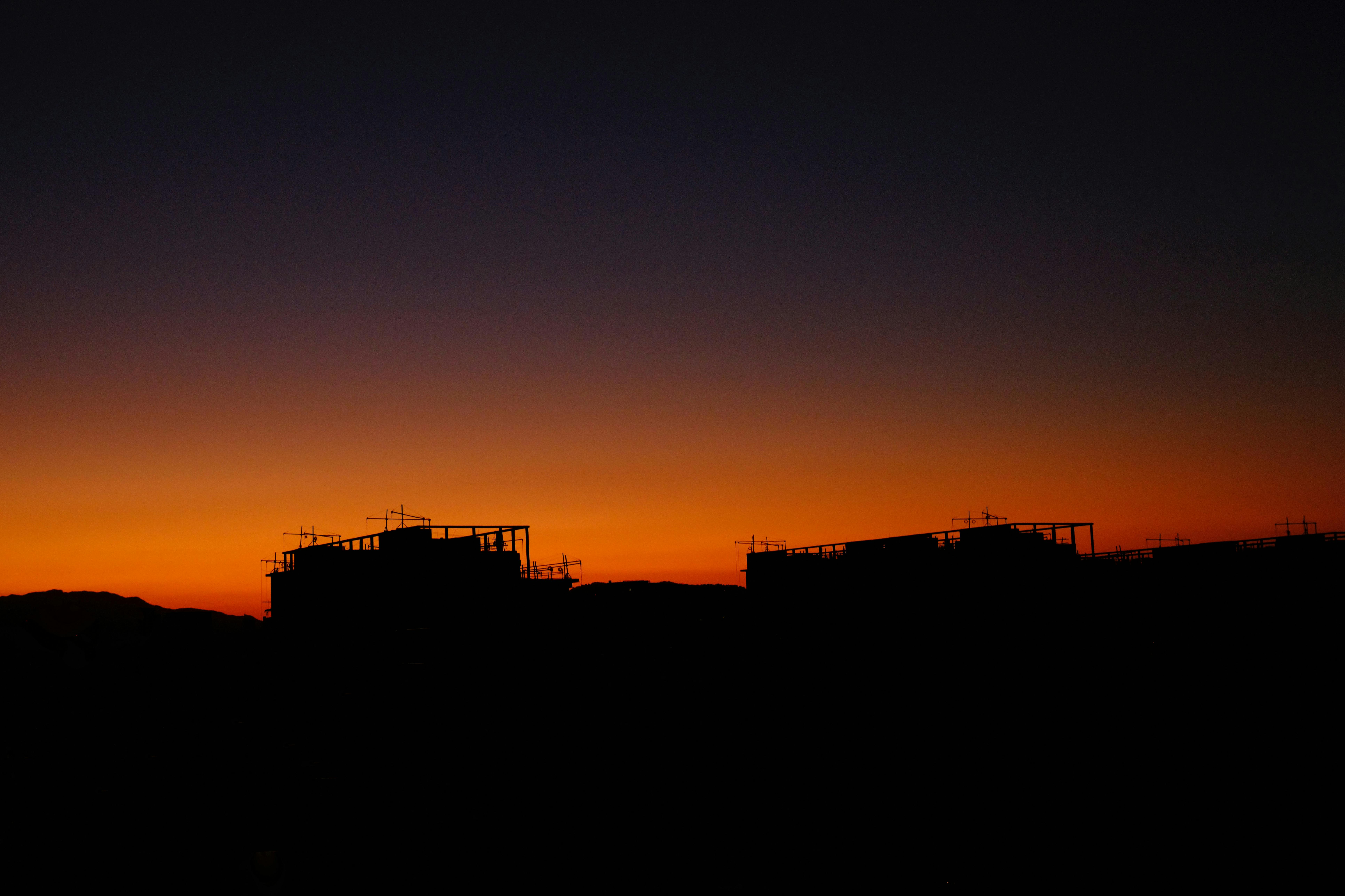 Silhouette of Buildings during Sunset · Free Stock Photo