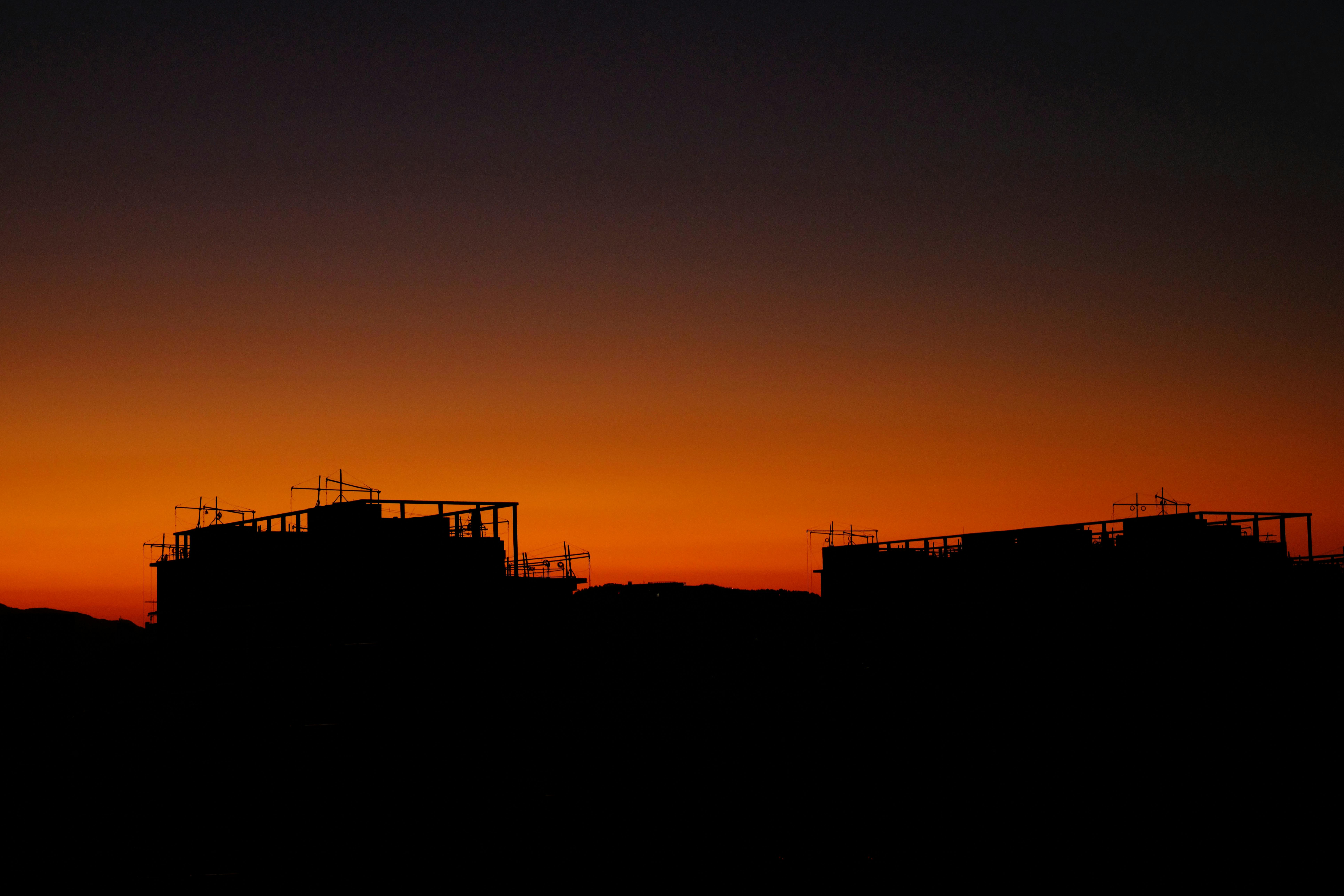 Silhouette of Buildings during Sunset · Free Stock Photo