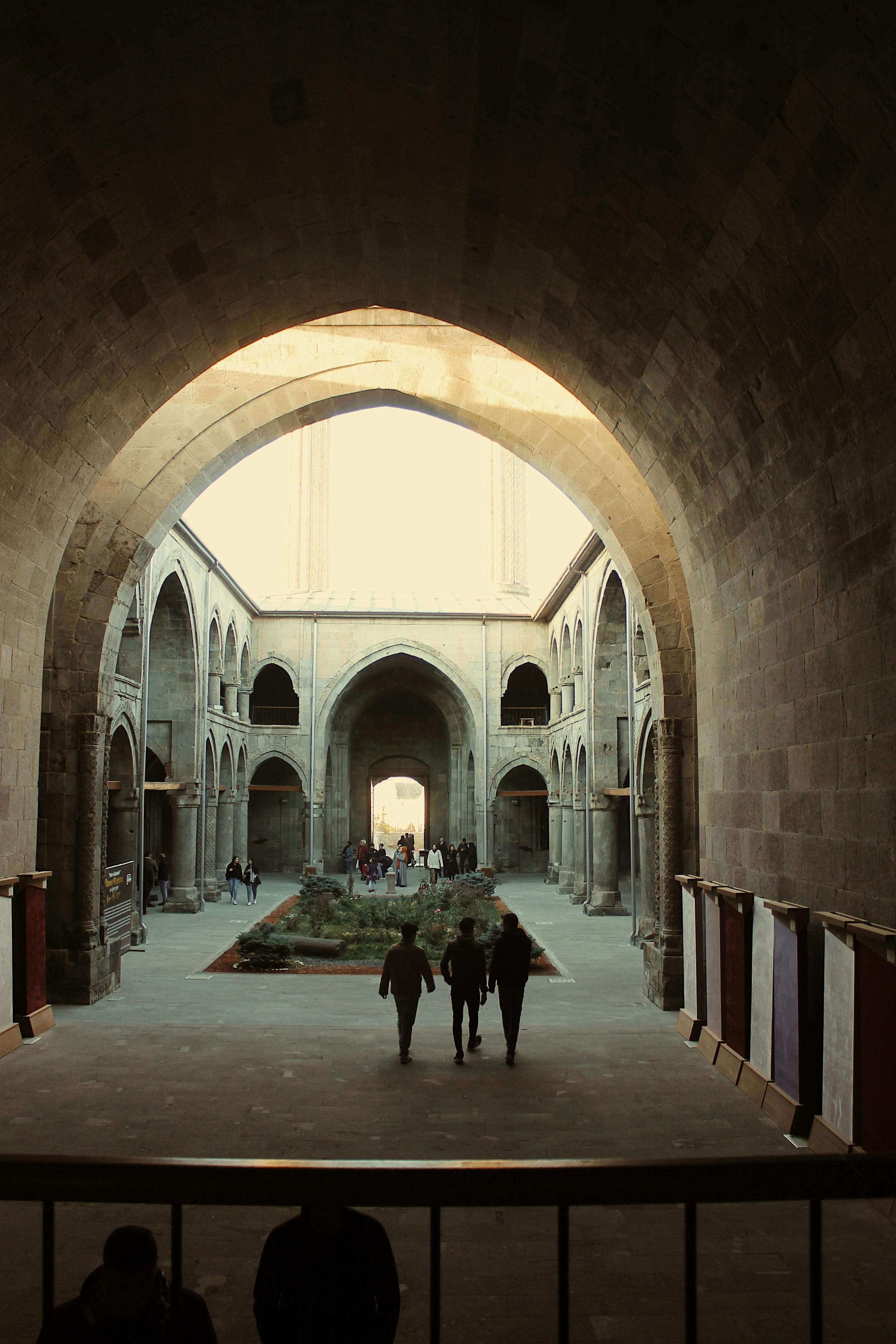 People Walking Inside the Cifte Minareli Medrese · Free Stock Photo