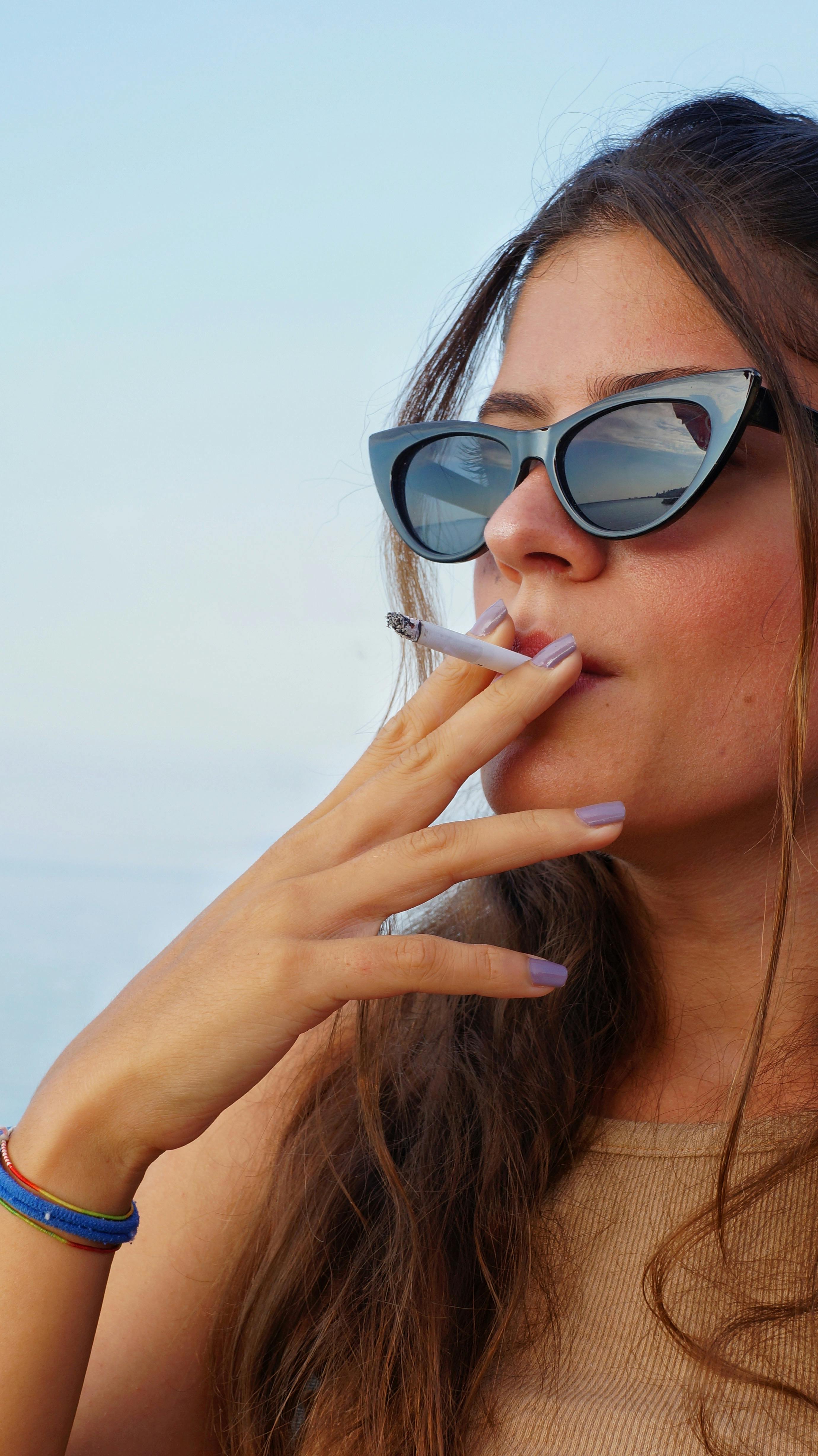 Girl Blowing Smoke Up