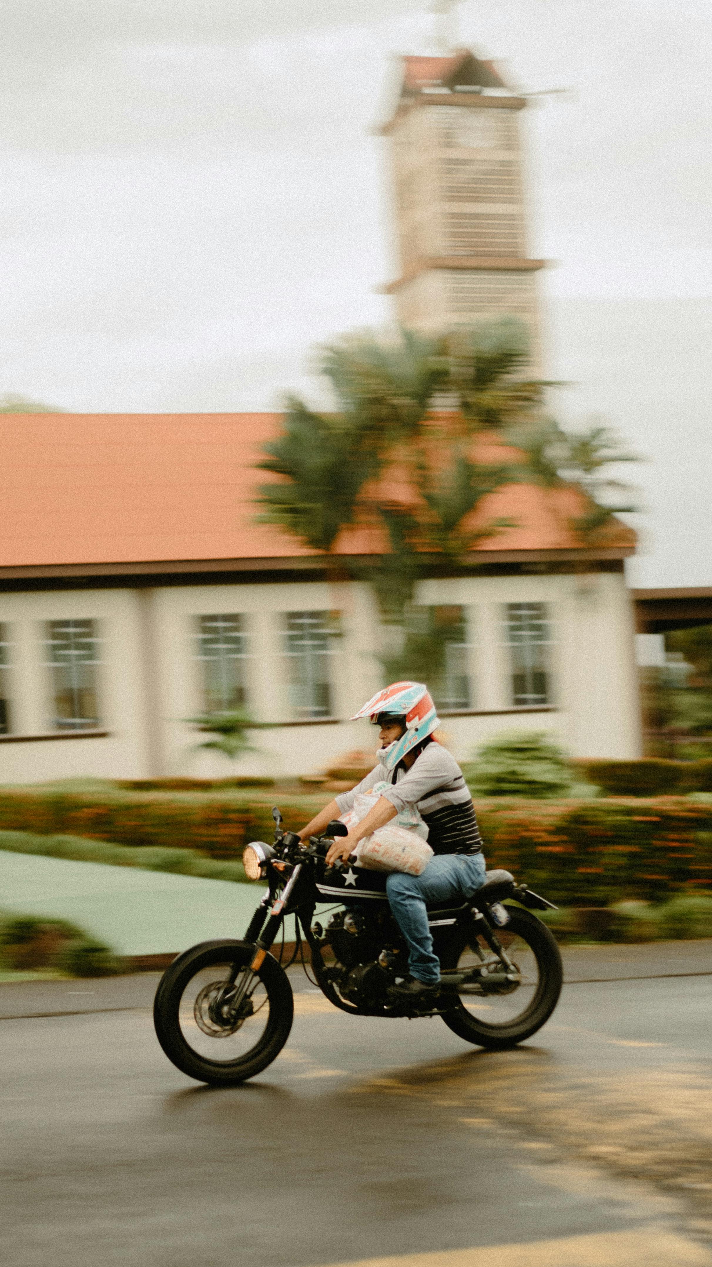 A Fast Moving Motorcycle on the Road · Free Stock Photo