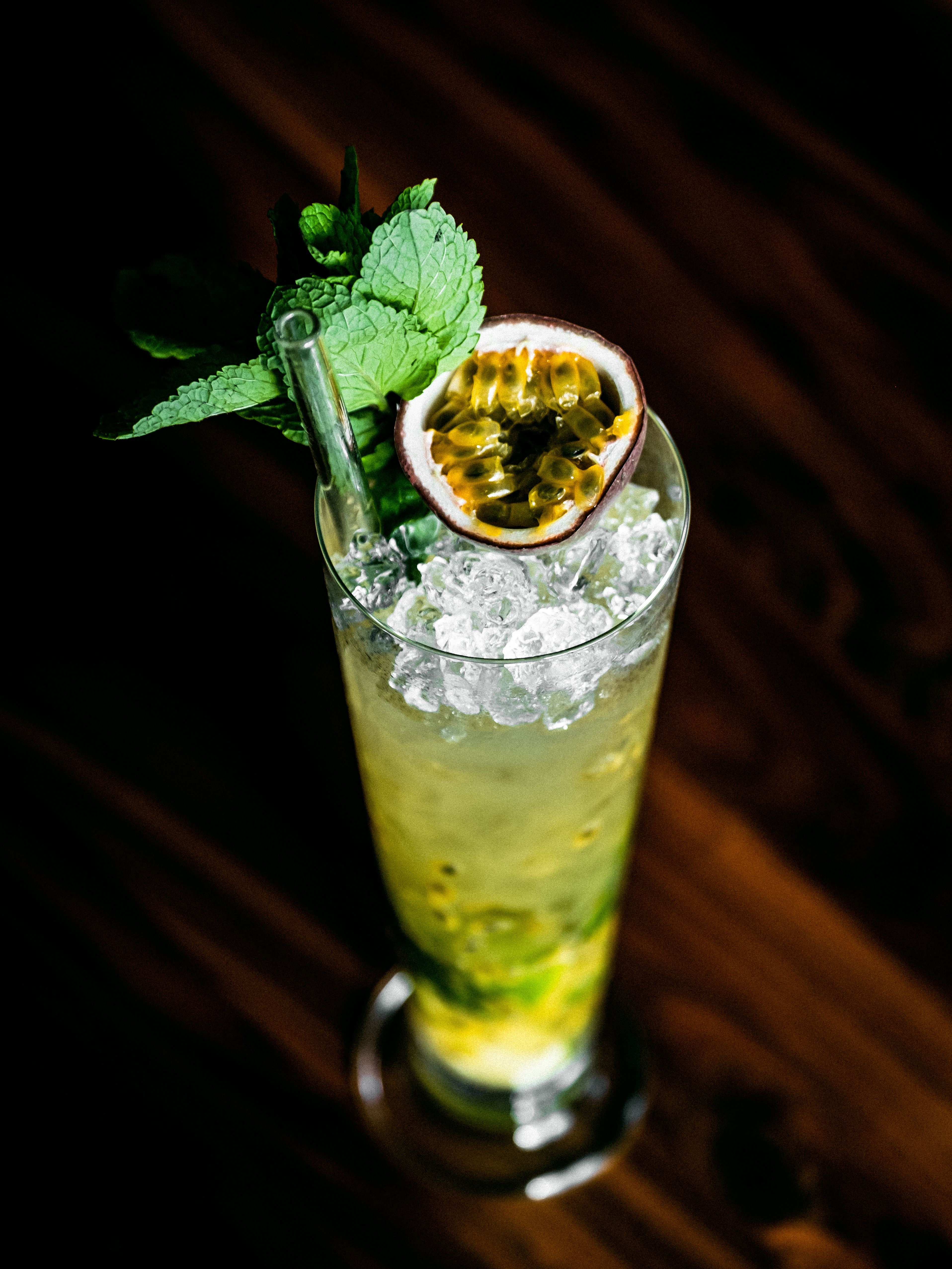 Yellow Liquid With Green Leaf on Clear Drinking Glass · Free Stock Photo