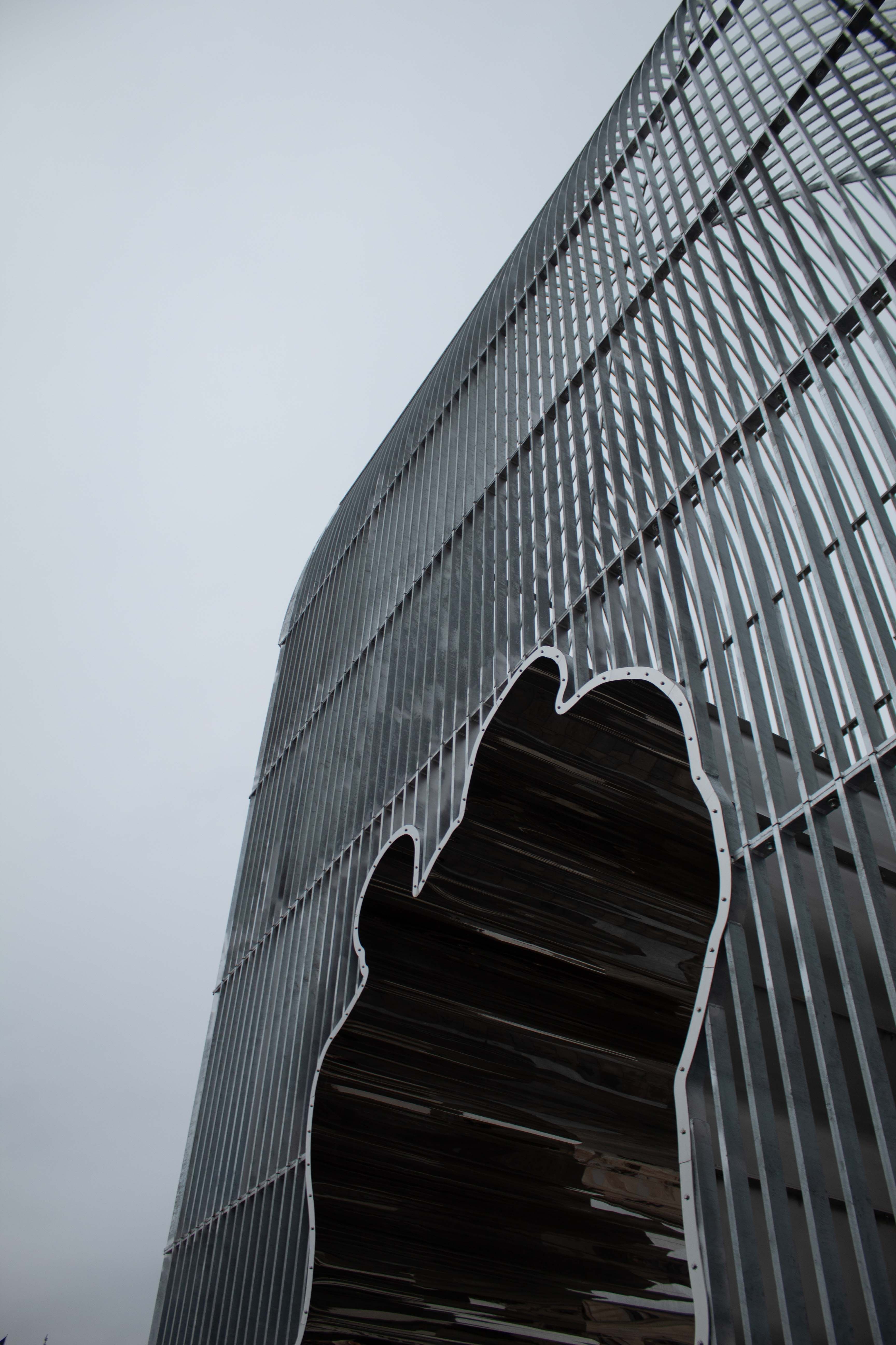 Curved Wooden Architectural Design under Clear Sky · Free Stock Photo