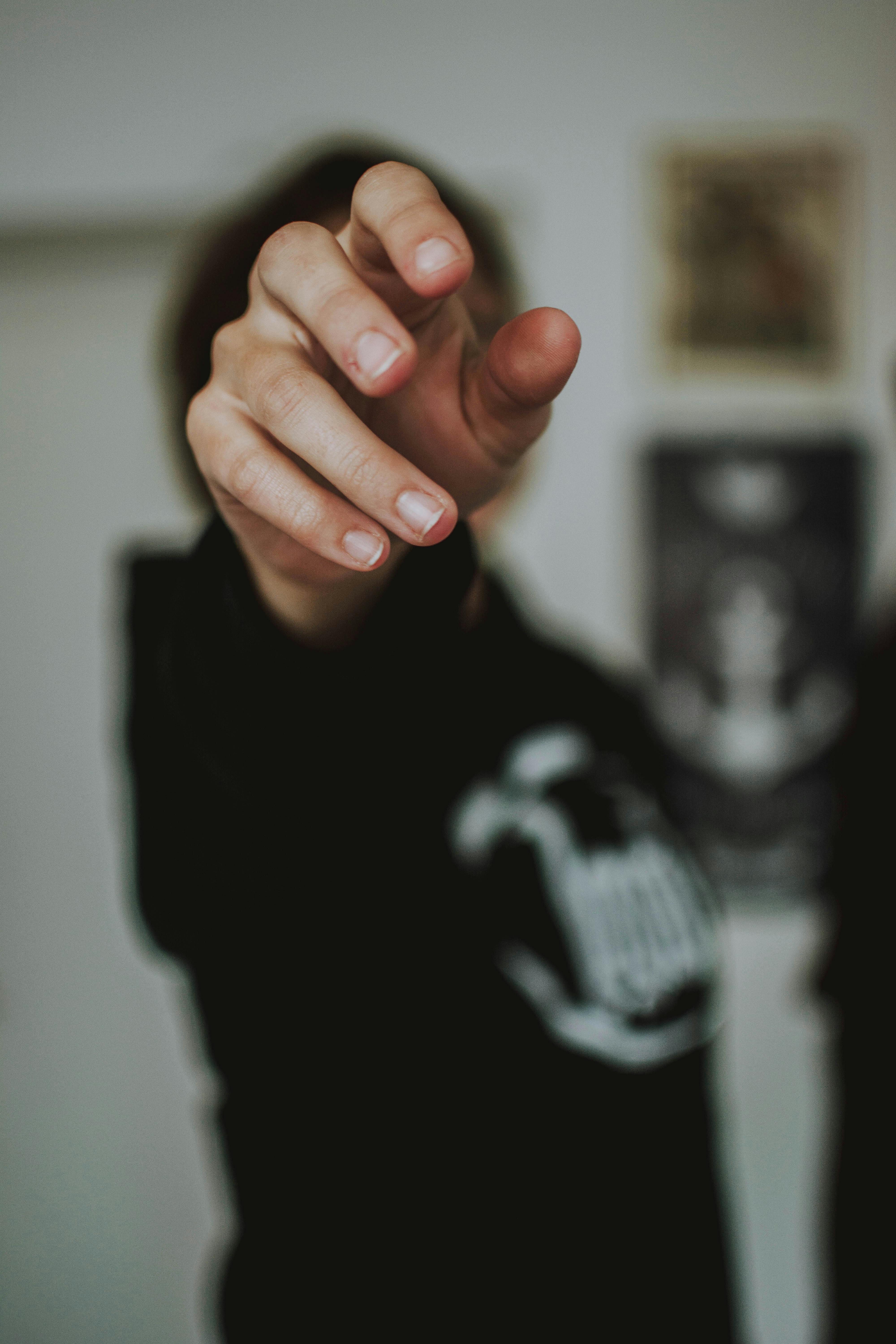 Focused Finger Pointing Forward Unfocused Person Photos, Download The ...