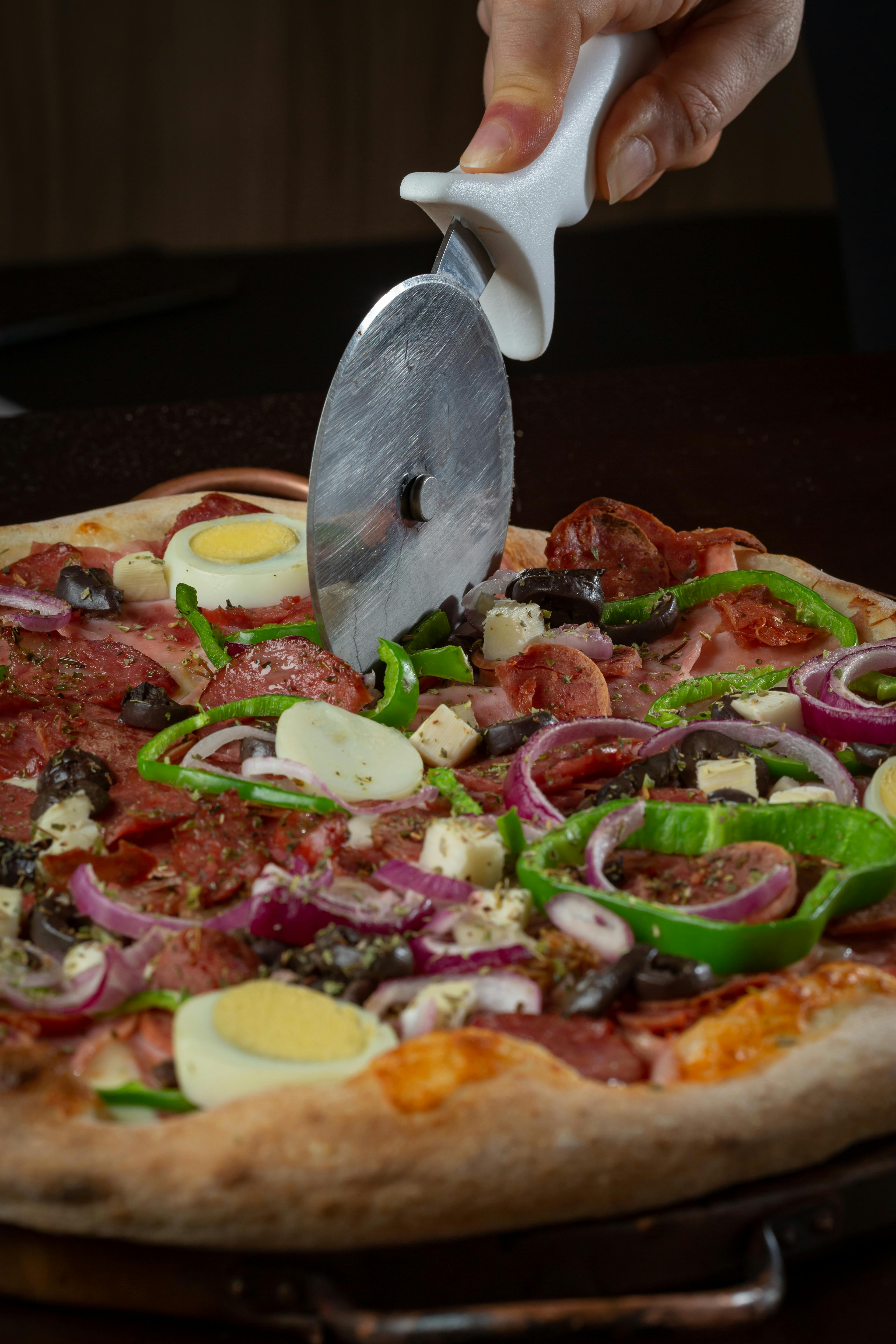 Hand Holding Pizza · Free Stock Photo