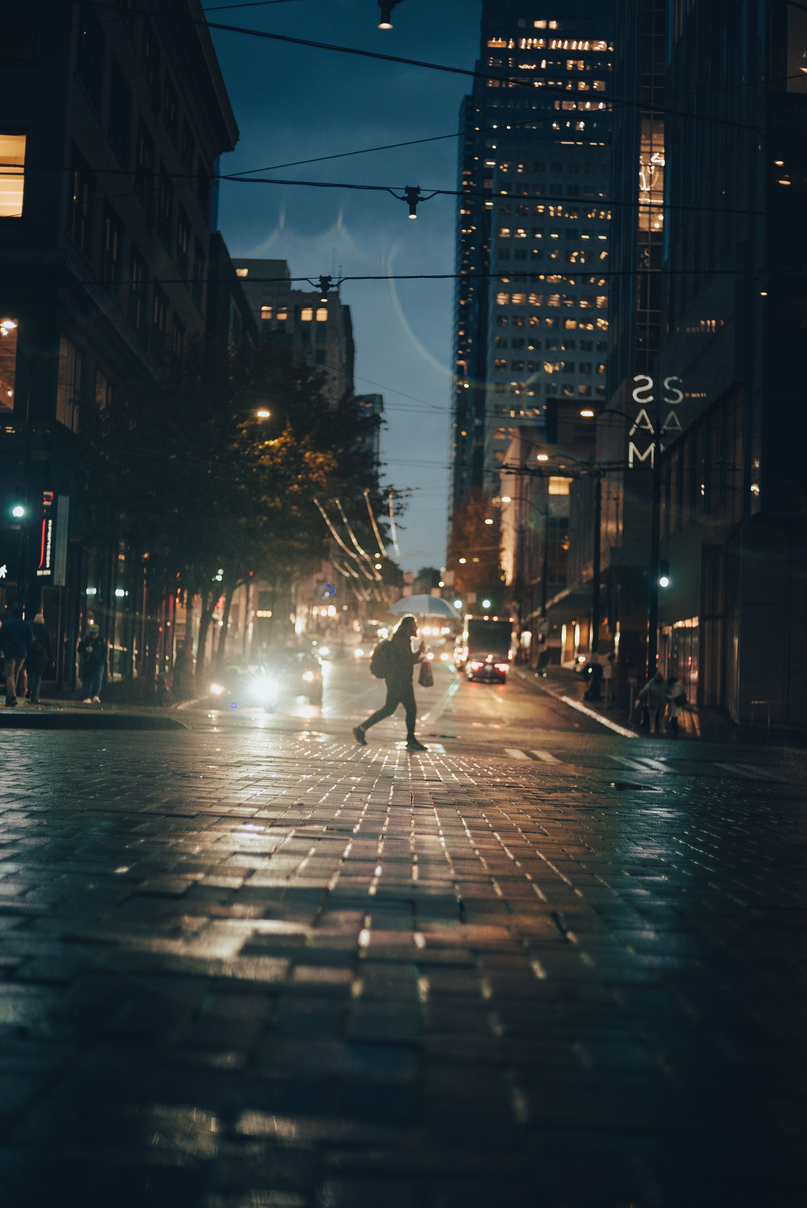 Person Crossing Road During Night Time · Free Stock Photo