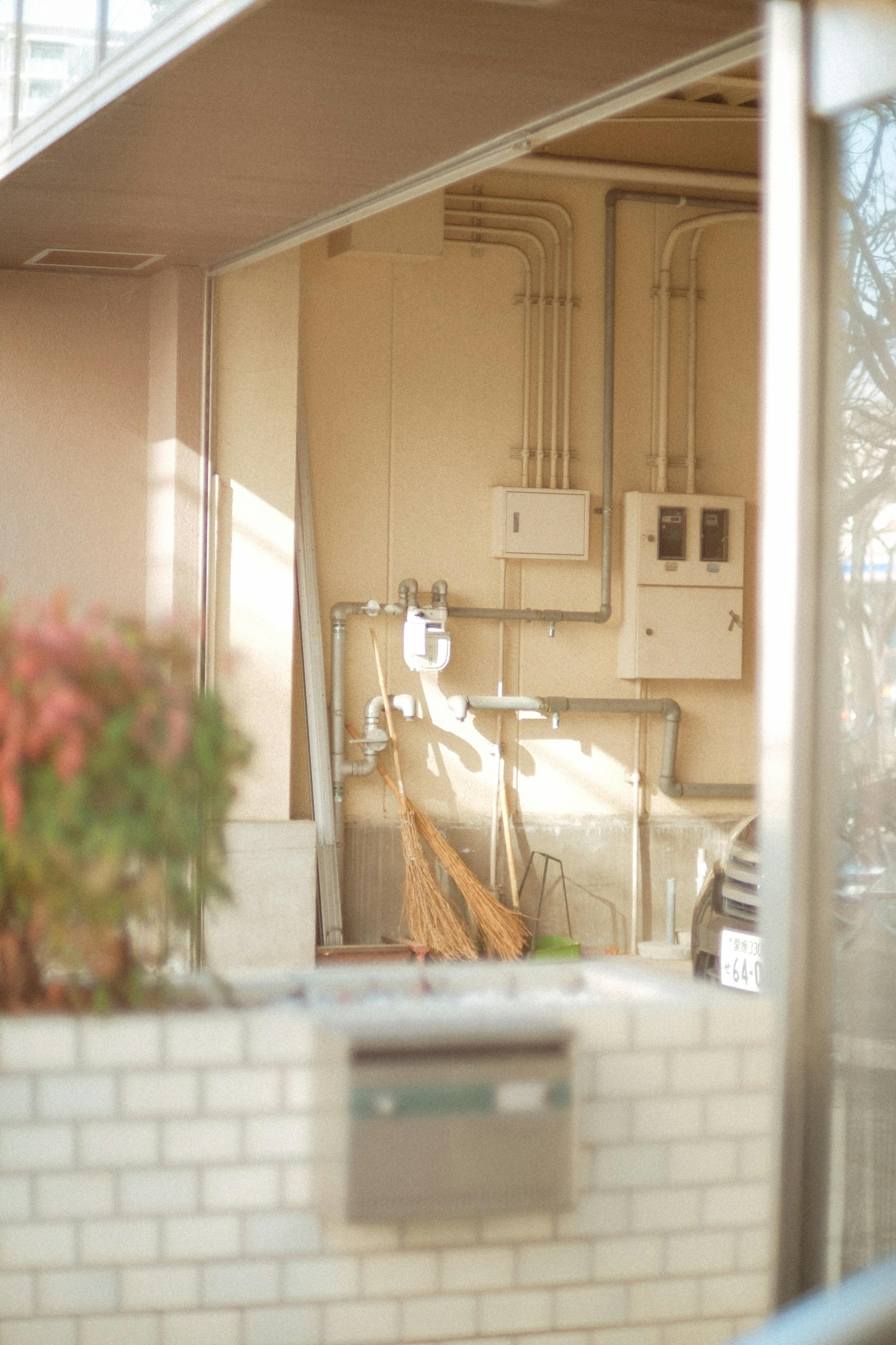 Brooms and Panels Inside House Garage · Free Stock Photo