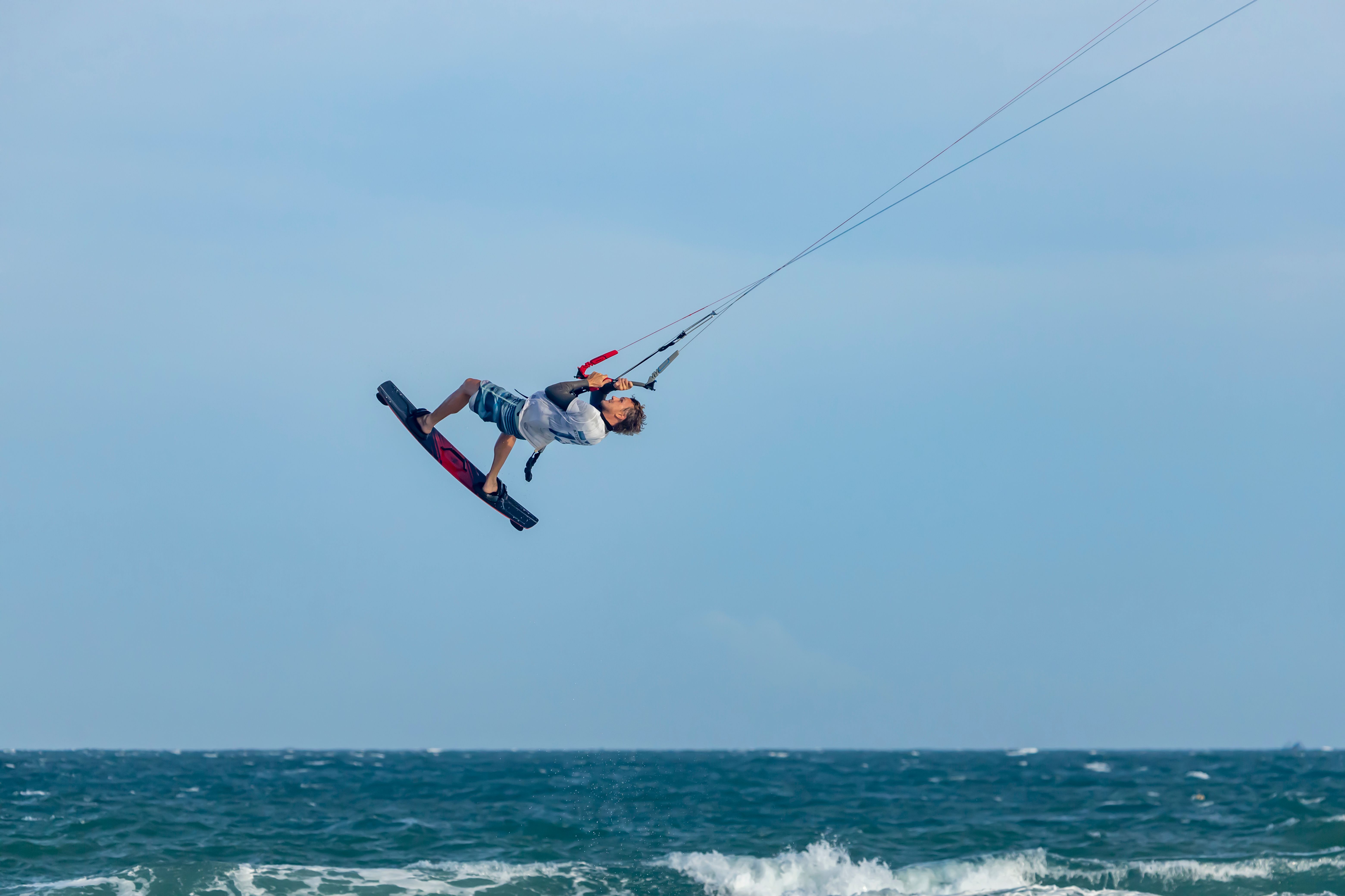 Back View of Man Kitesurfing · Free Stock Photo