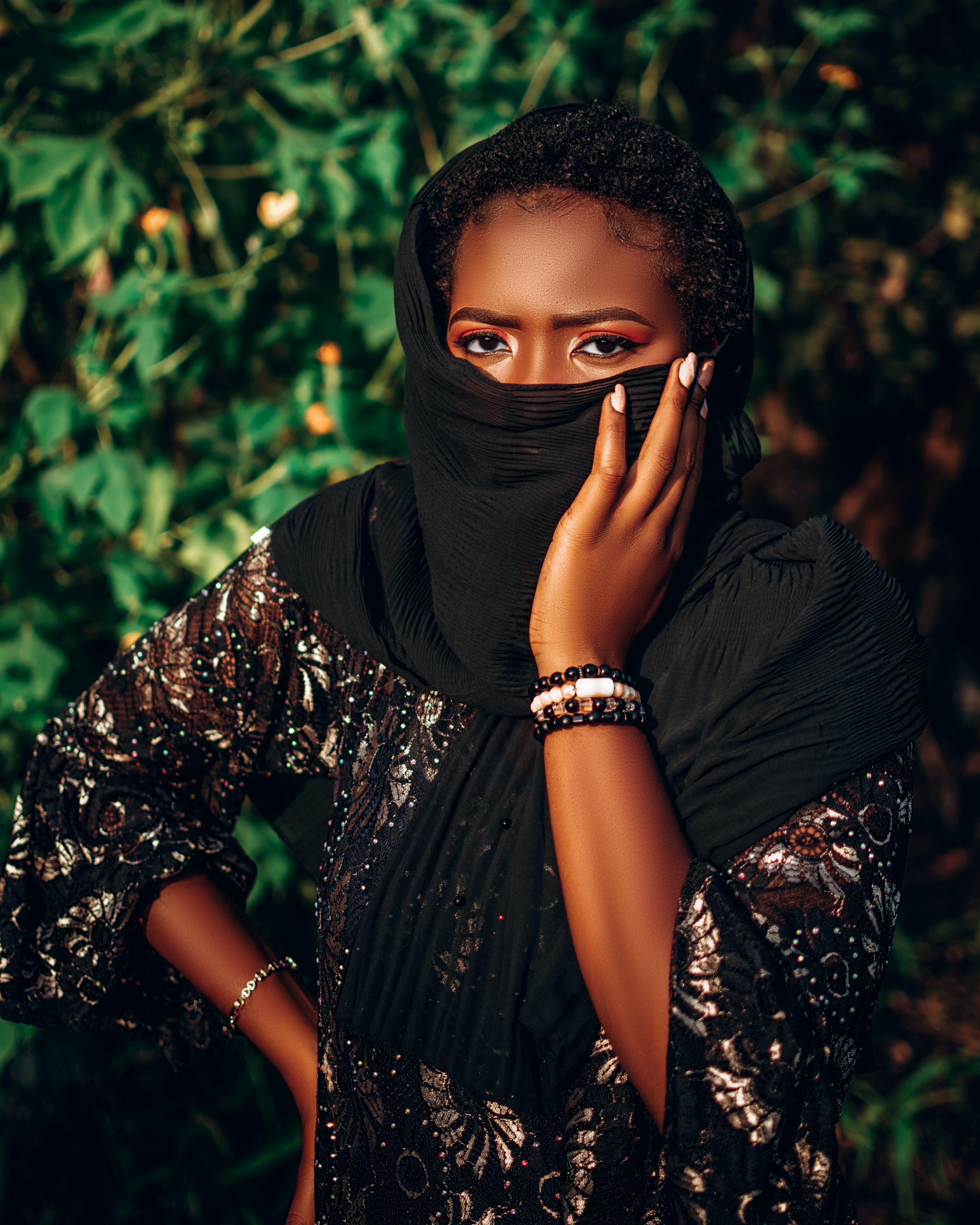 Woman in Black Headscarf Covering Her Face · Free Stock Photo