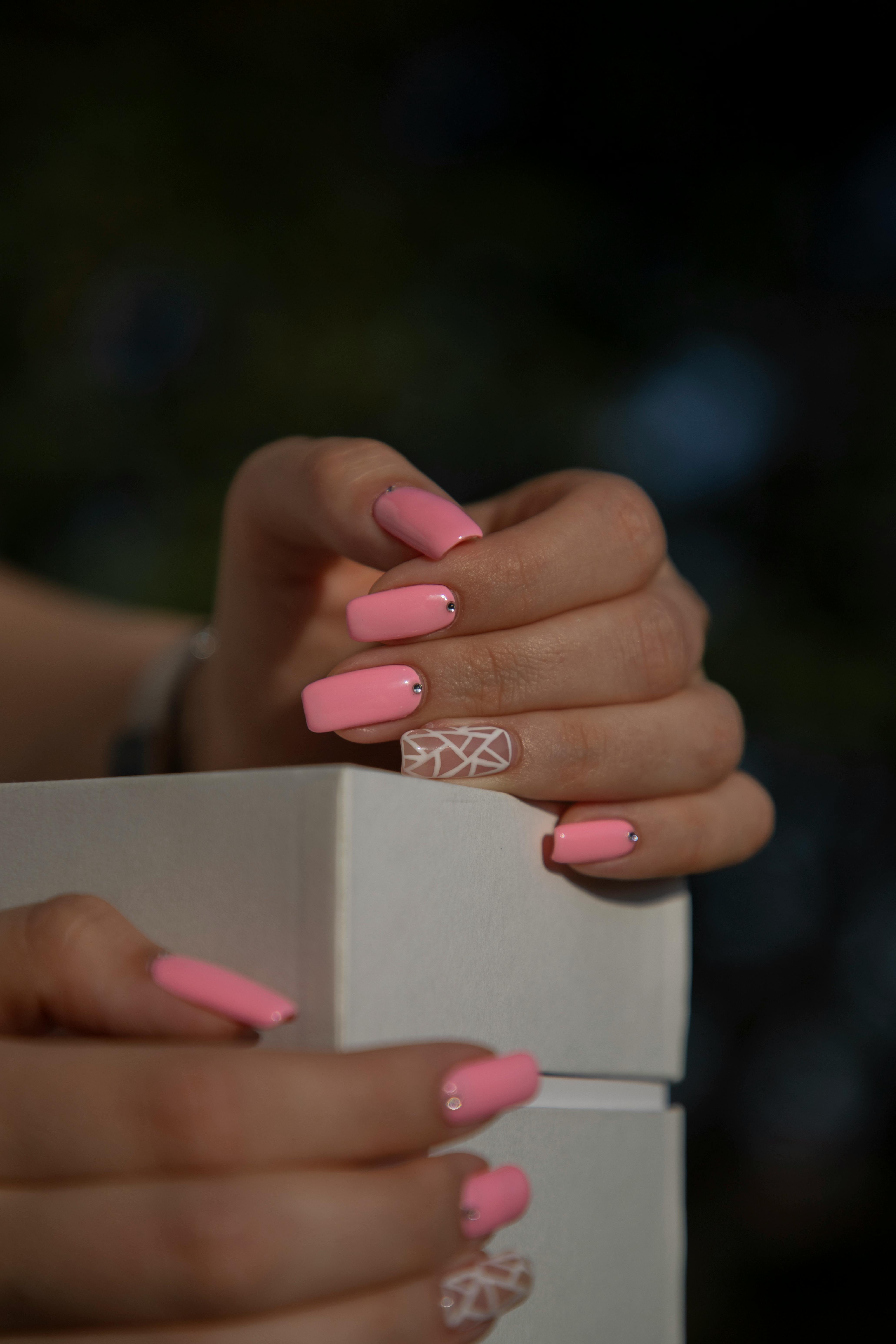 Hand with Pink Nails Holding White Box · Free Stock Photo