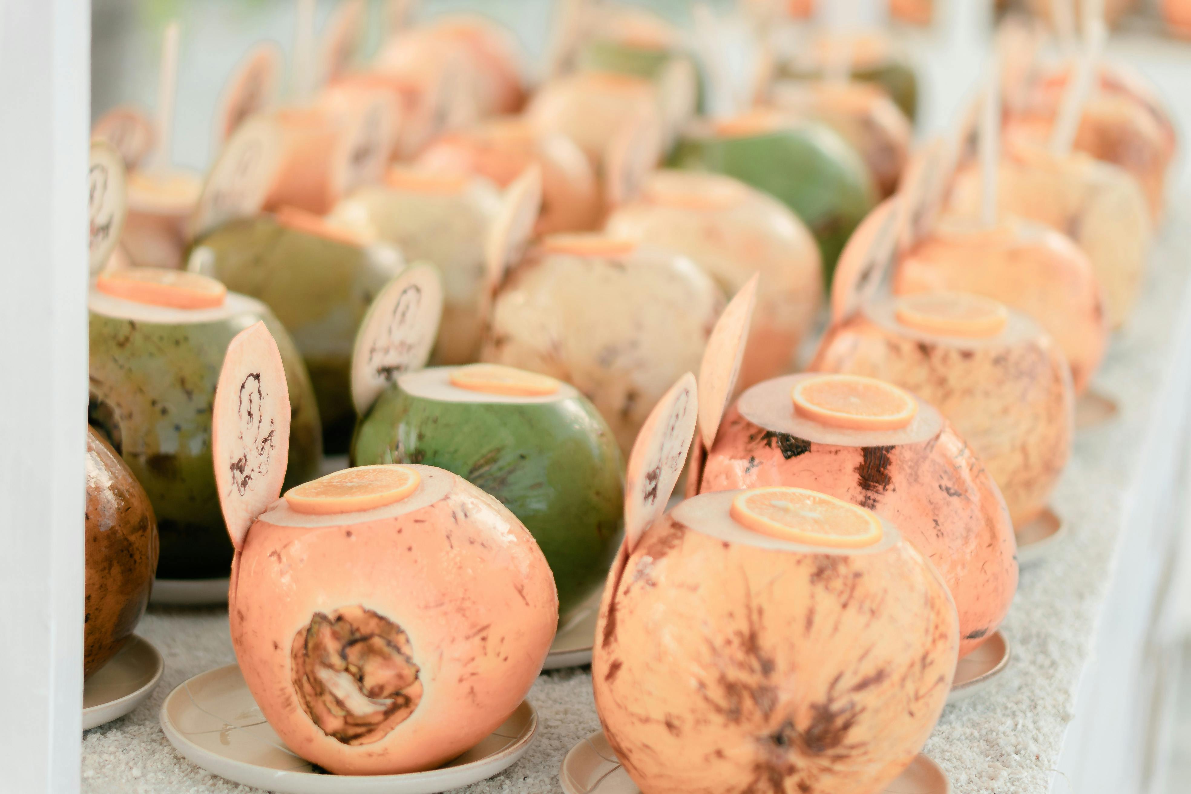 Photo Of Woman Cracking Coconut Shells · Free Stock Photo