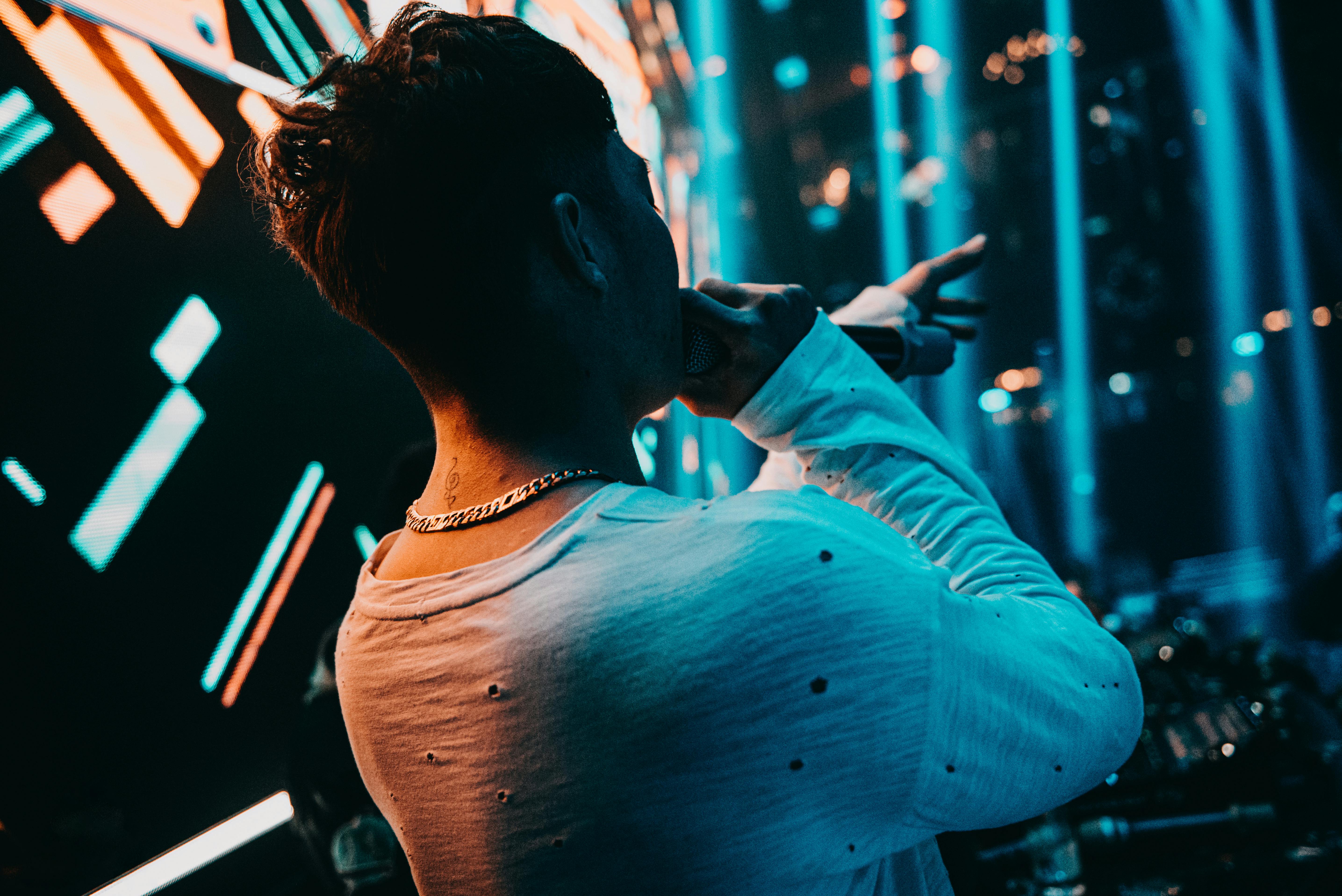 A Female Singer Singing Emotionally · Free Stock Photo