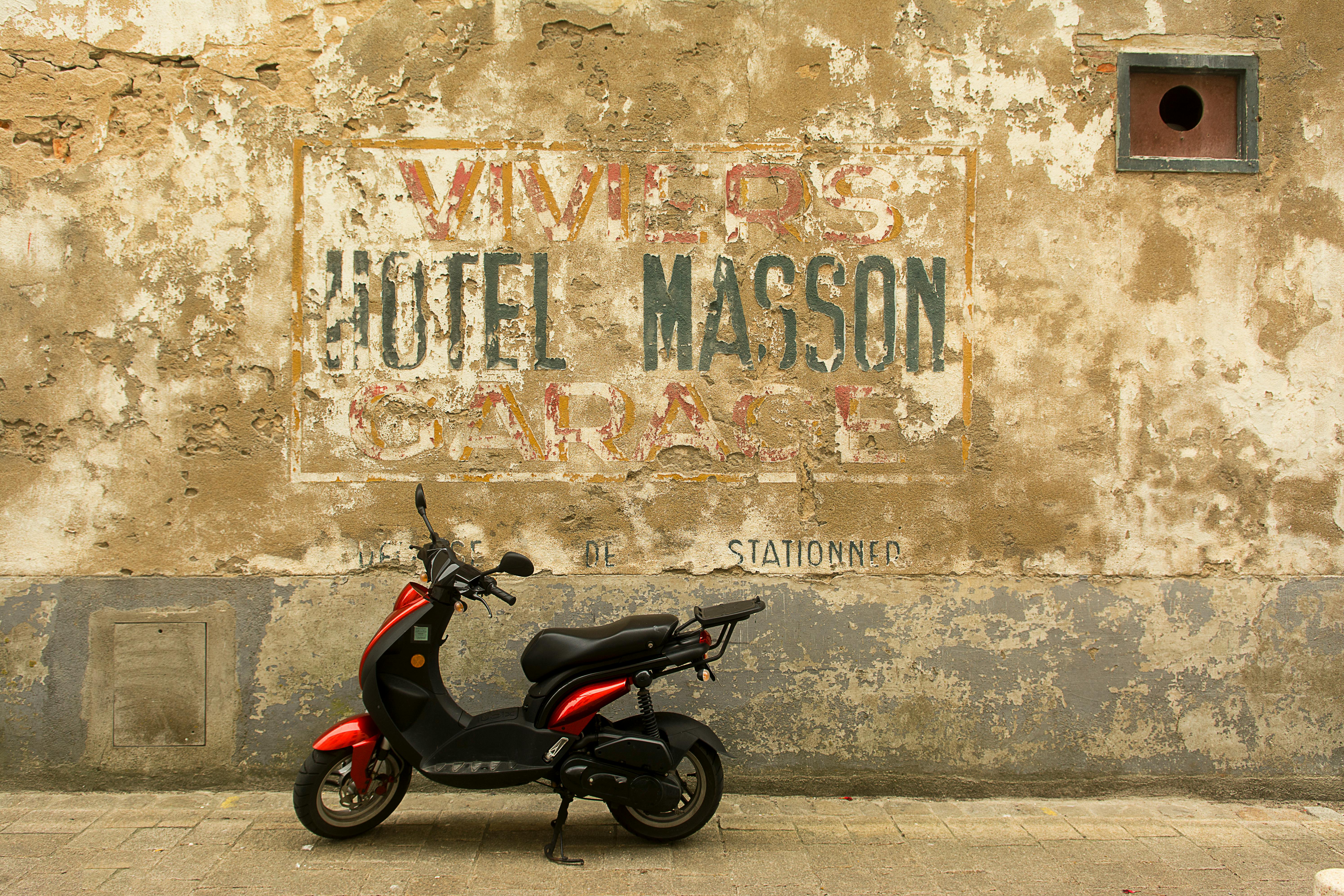 Motorcycle in front of Old, Damaged Building · Free Stock Photo