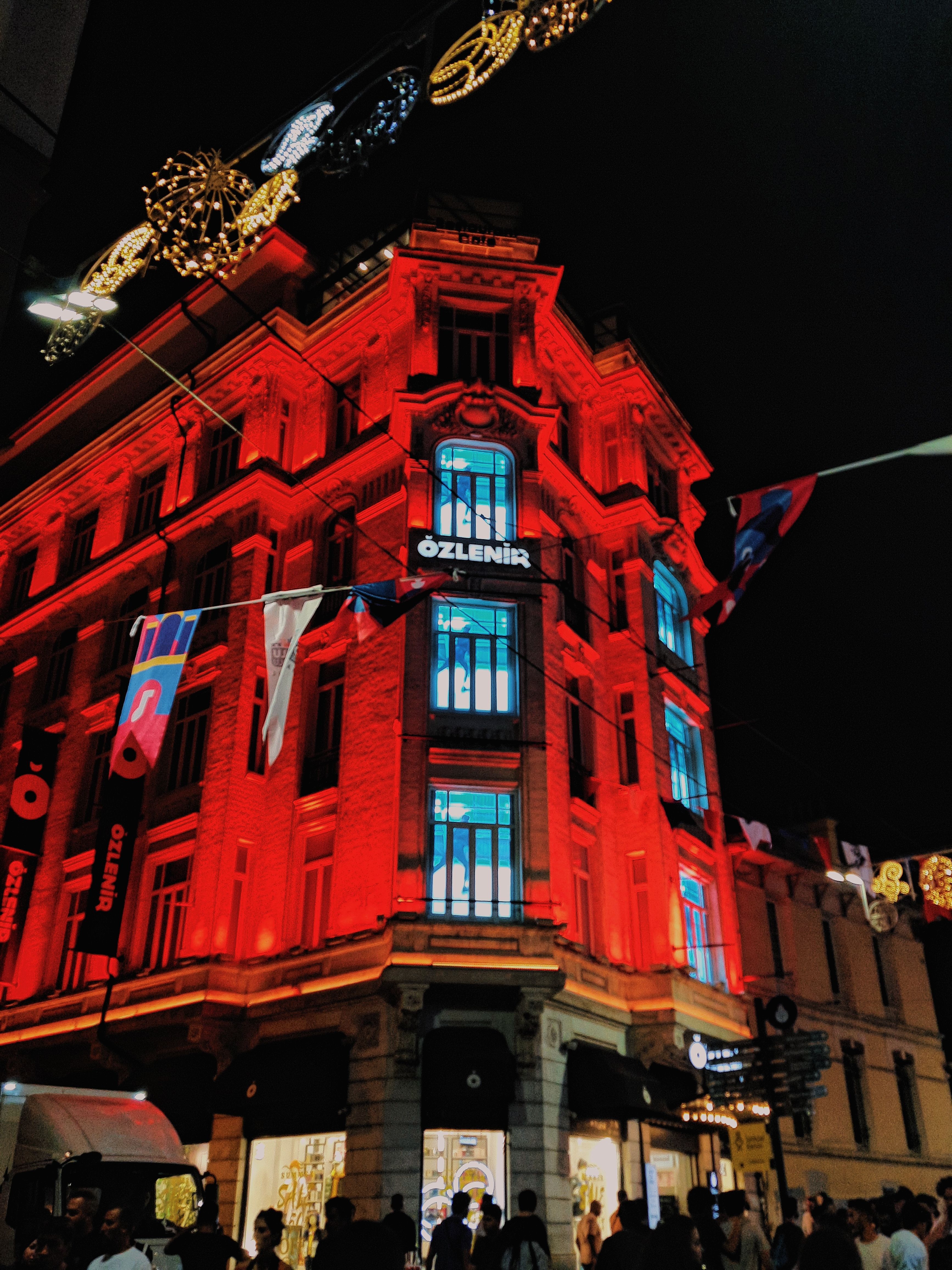 Corner Building Illuminated with Red Light · Free Stock Photo