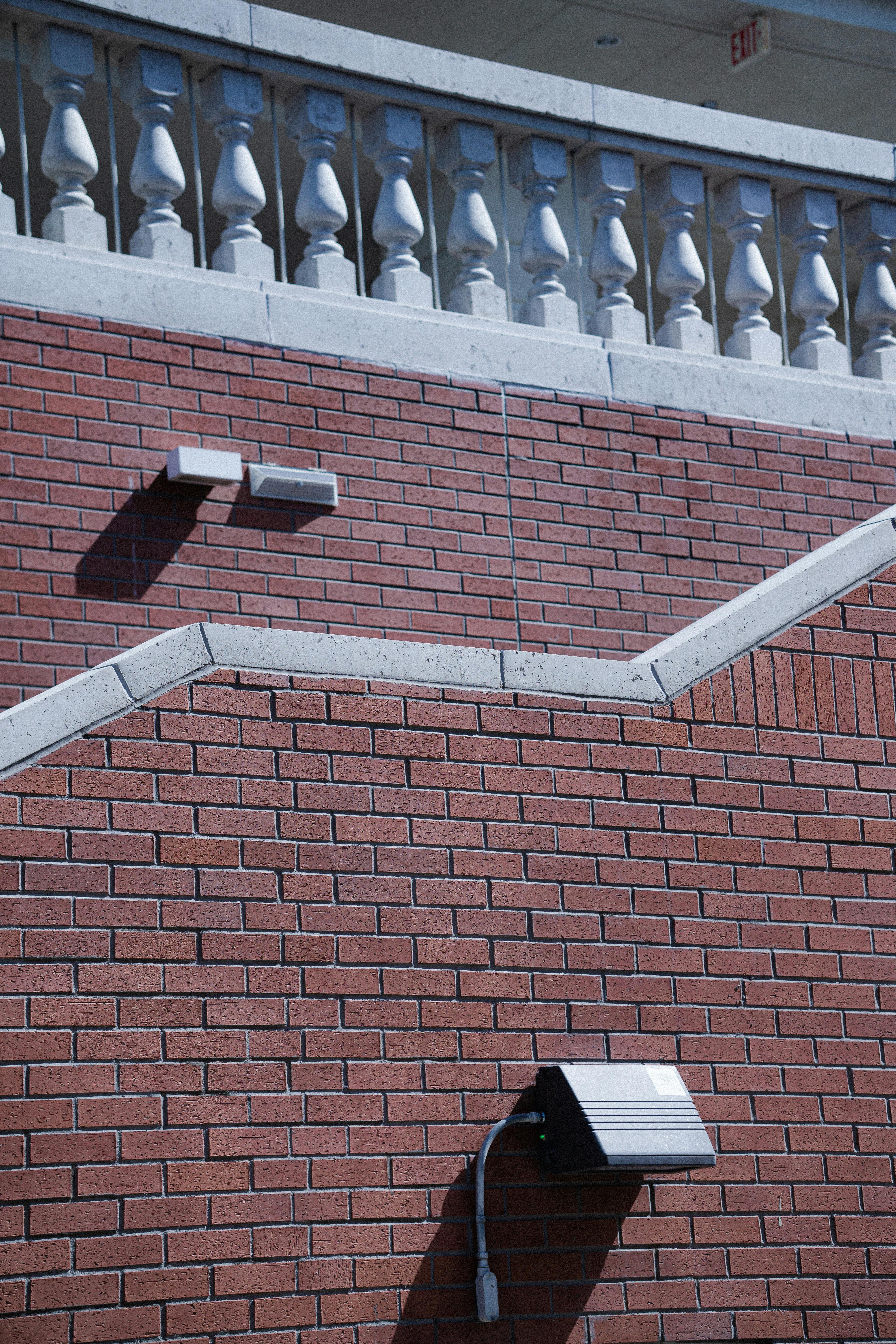 A Brick Wall of a Building · Free Stock Photo