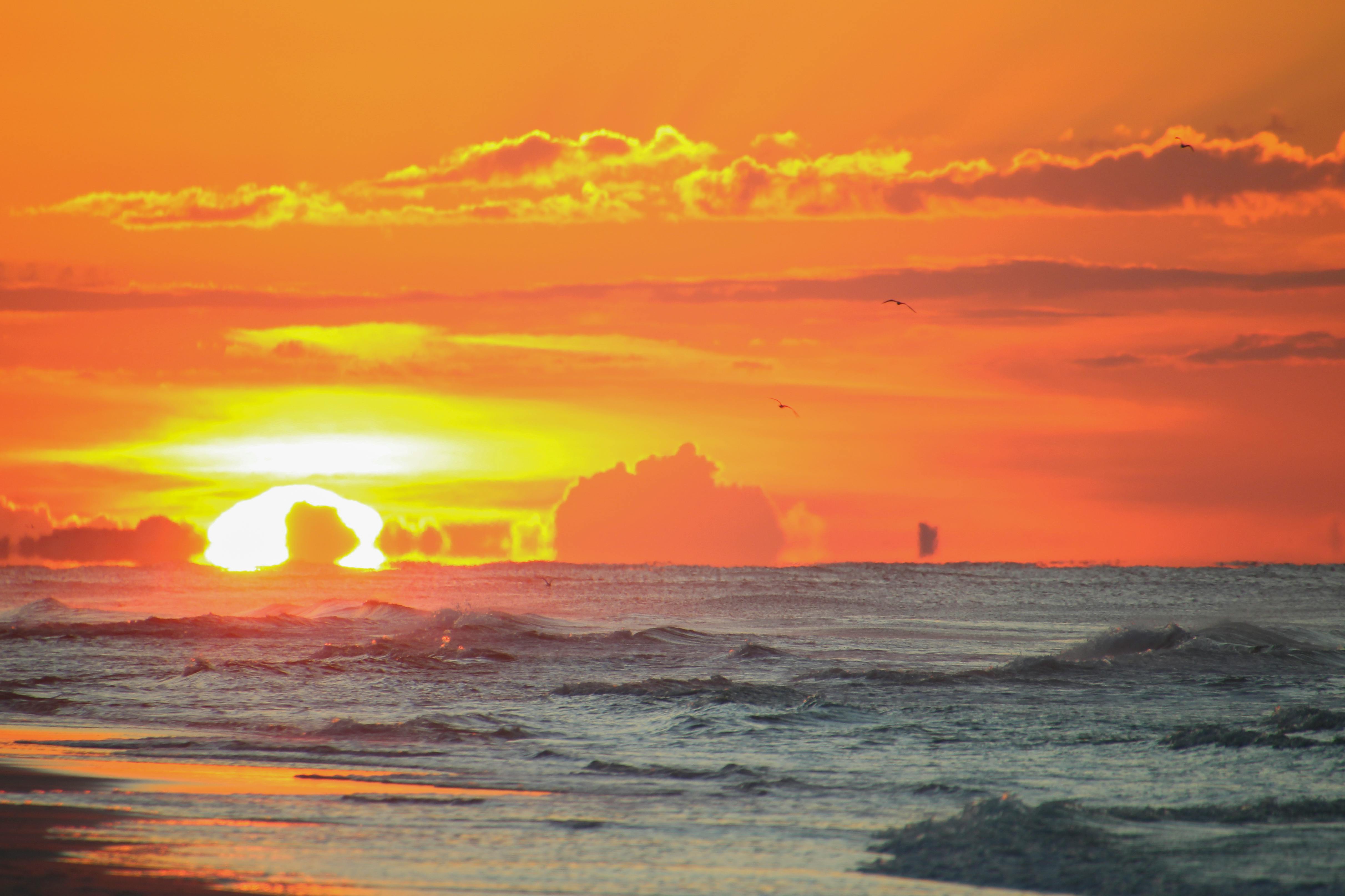 An Ocean Waves During Sunset · Free Stock Photo