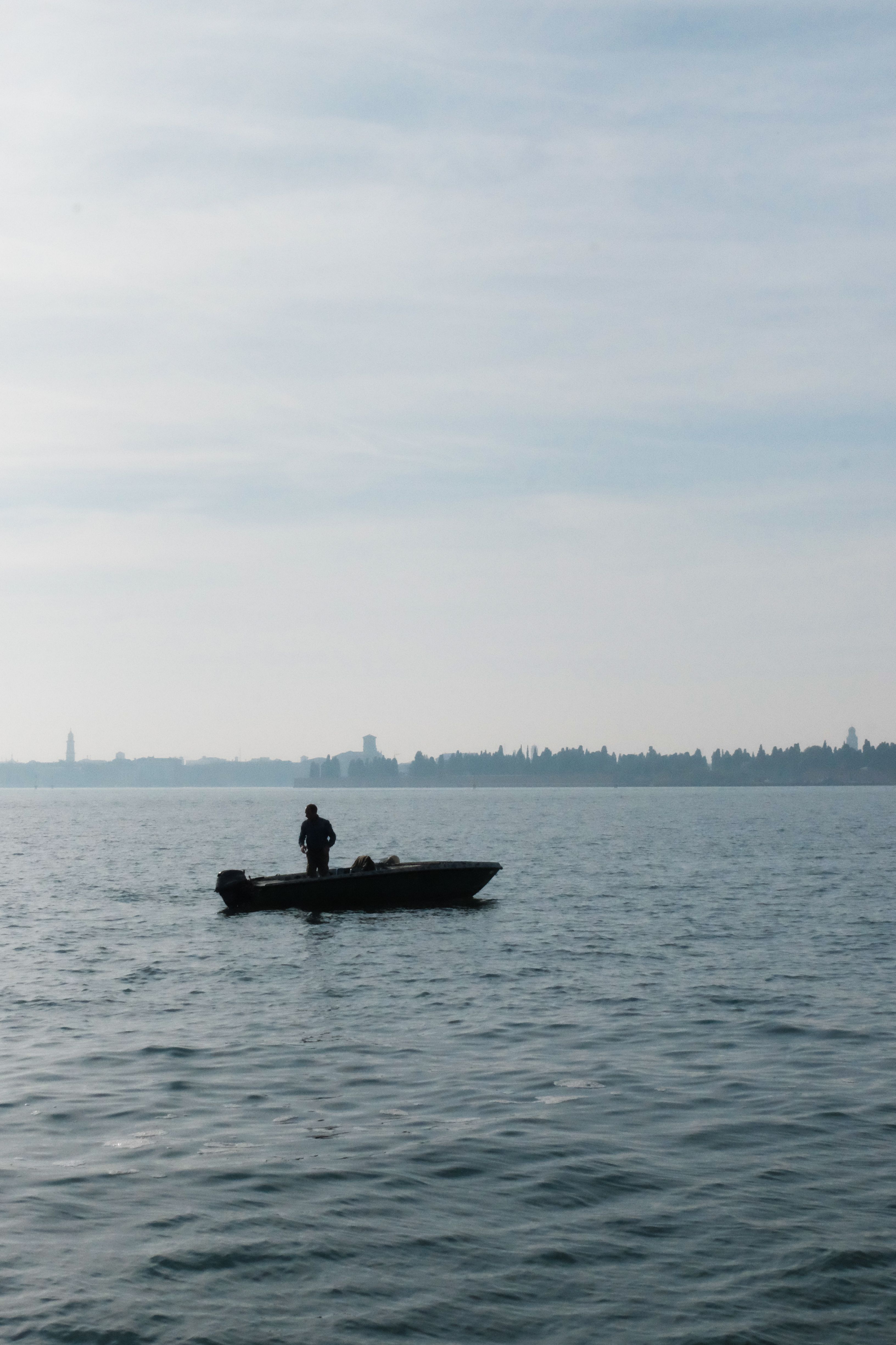 A Person Riding a Boat on the Sea · Free Stock Photo