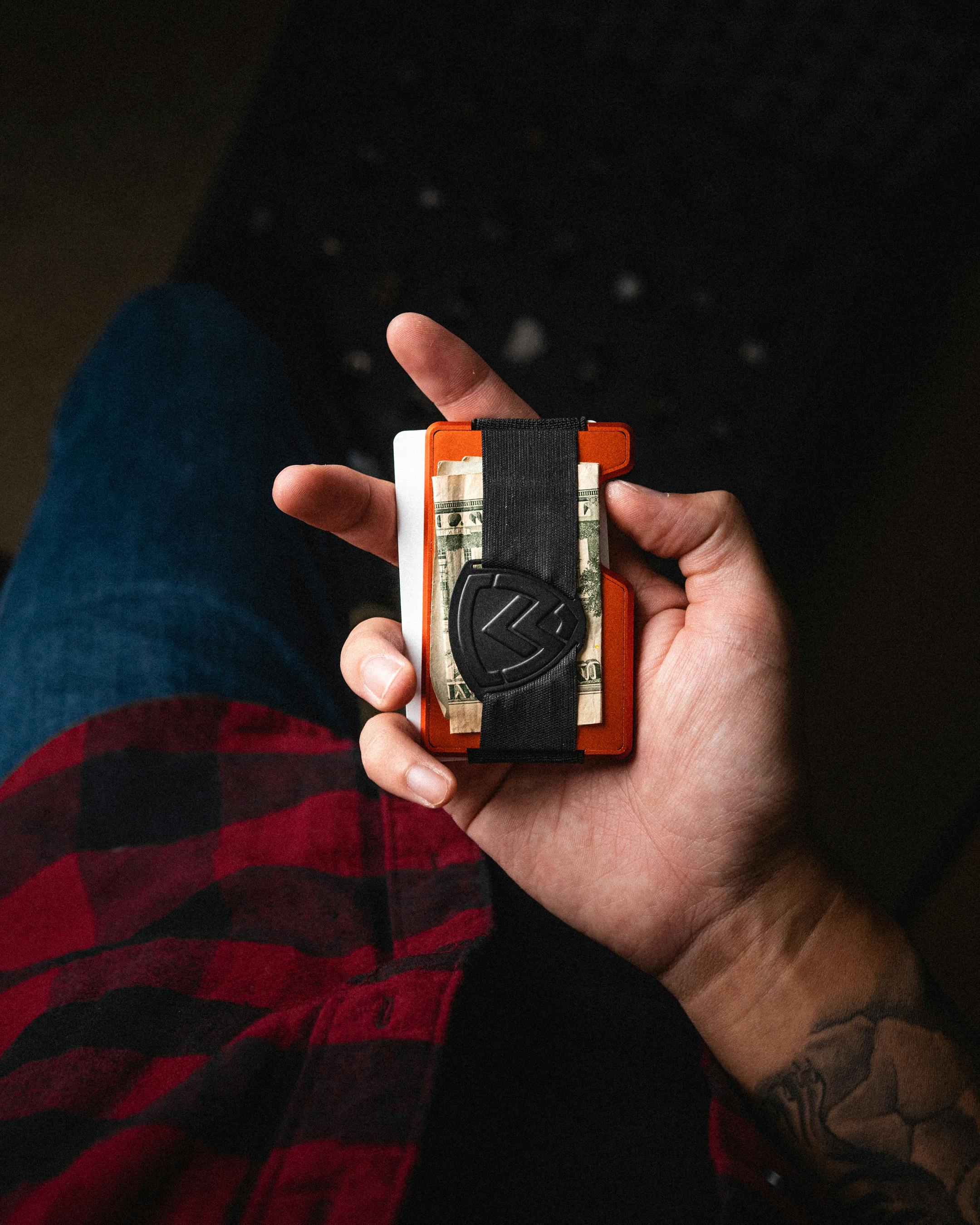 Photograph of Person Holding Black Leather Wallet with Money · Free ...