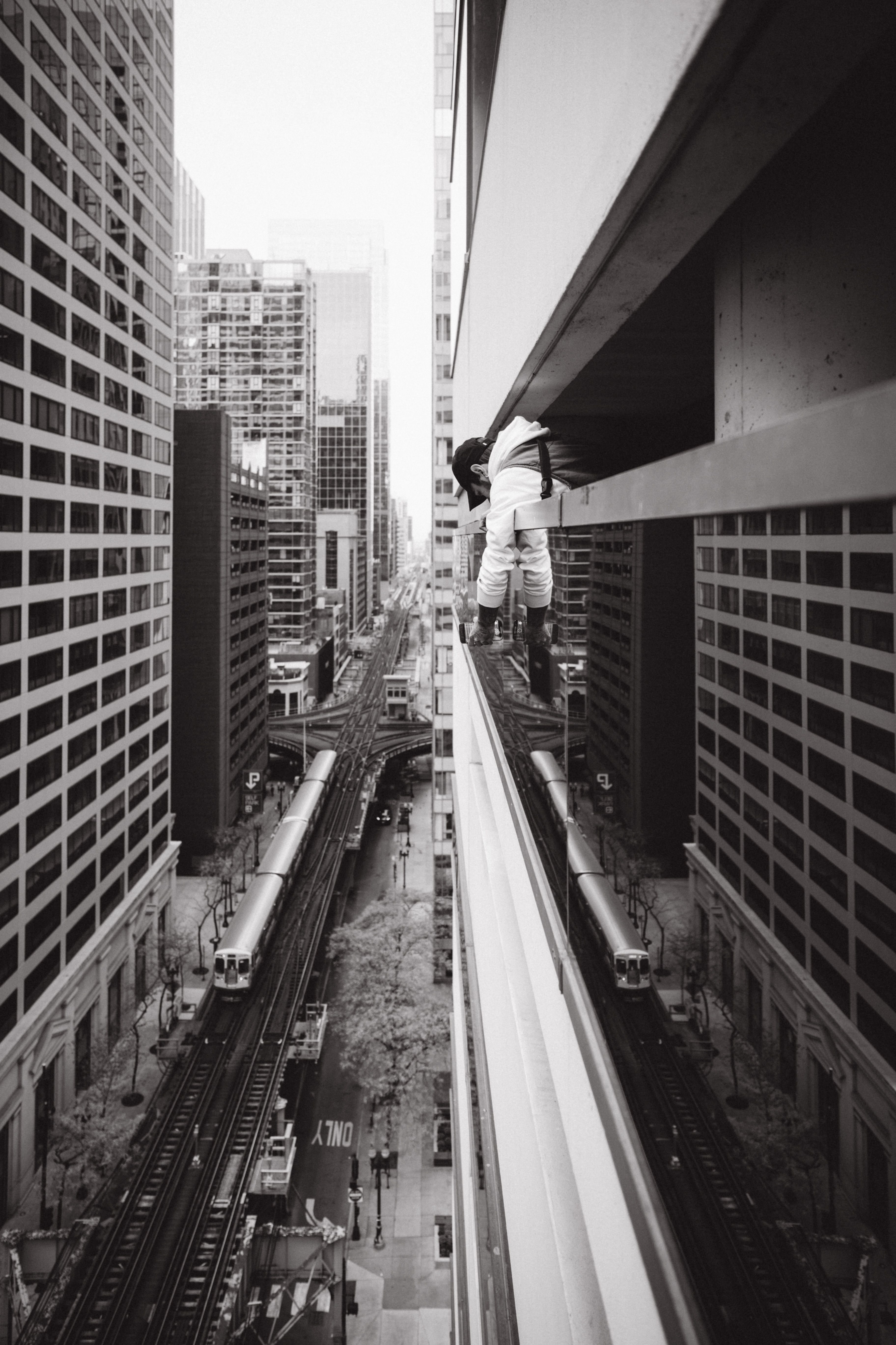 Man Hanging Out from a Balcony · Free Stock Photo