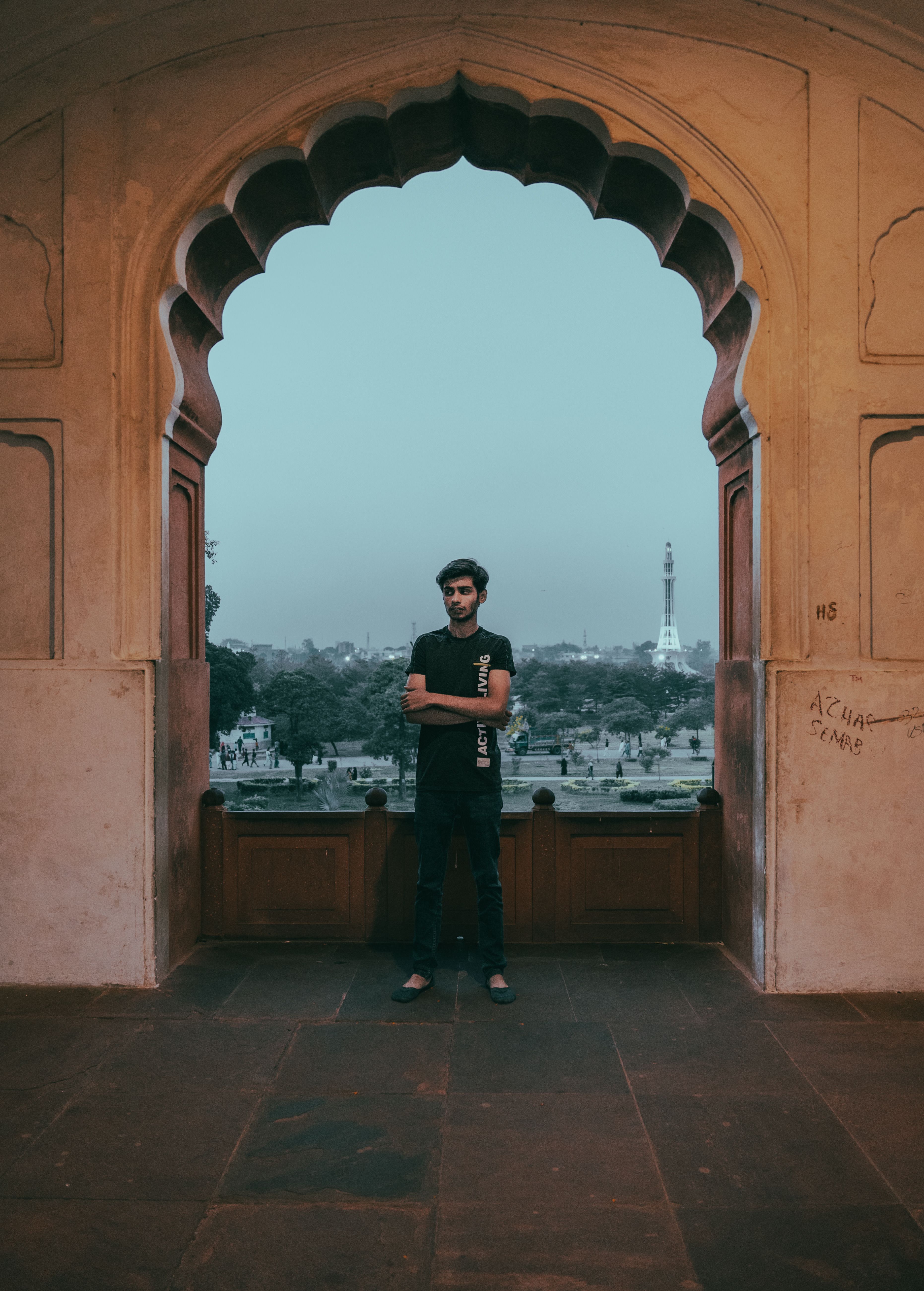 Man Posing Under Arch in Castle · Free Stock Photo