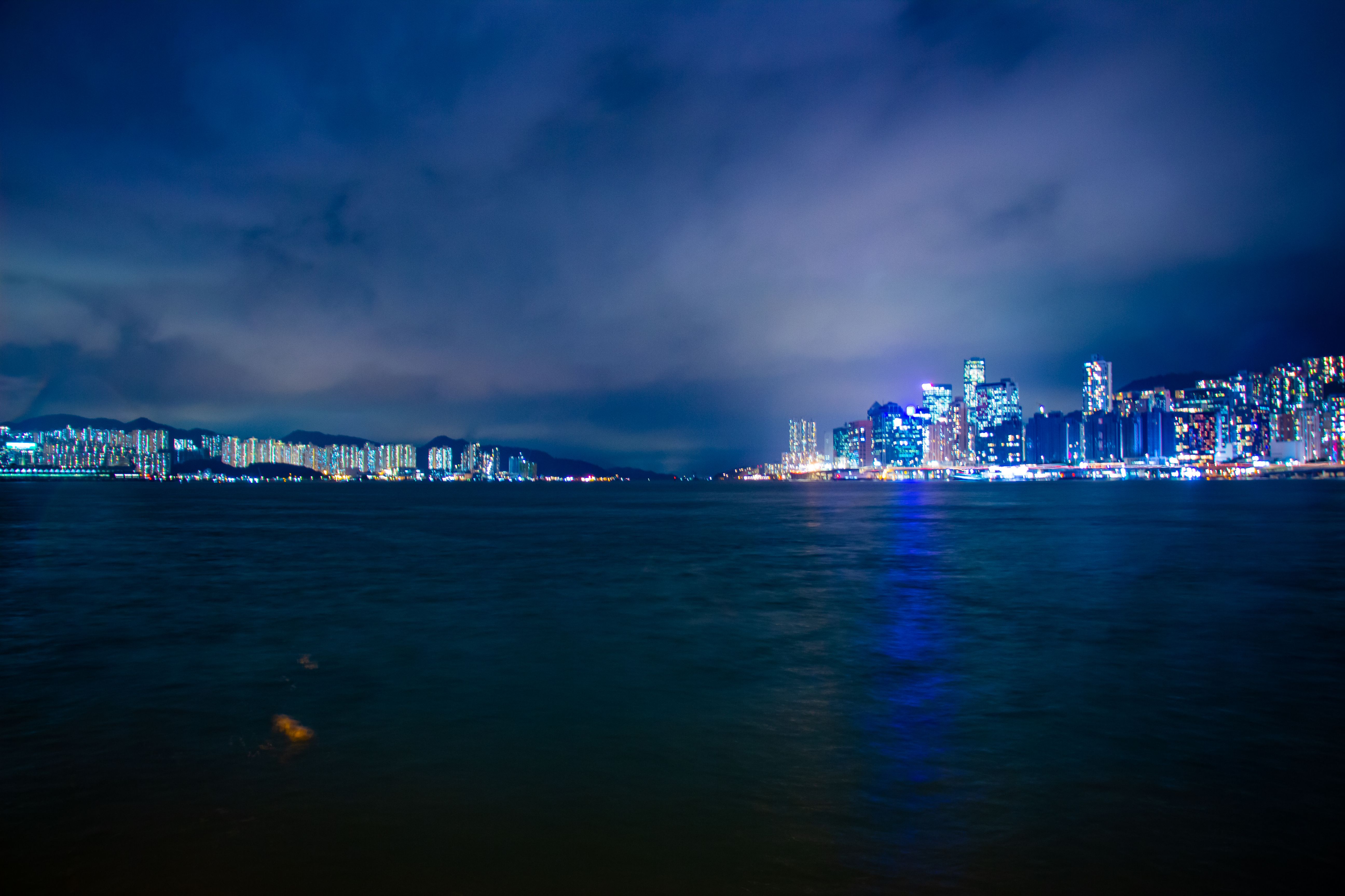 Illuminated City on Coast at Night · Free Stock Photo