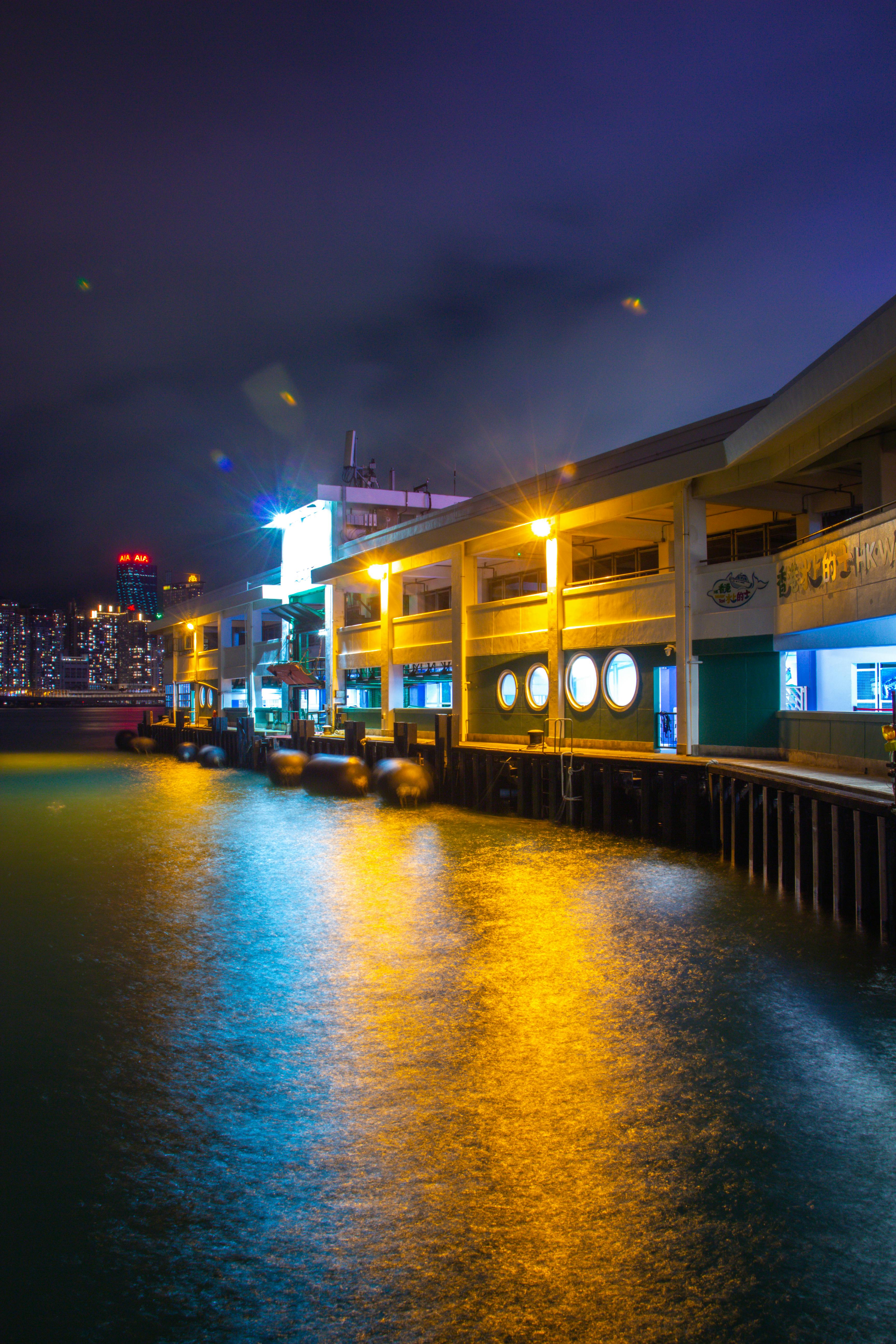 Concrete Structure Beside a River During Night Time · Free Stock Photo